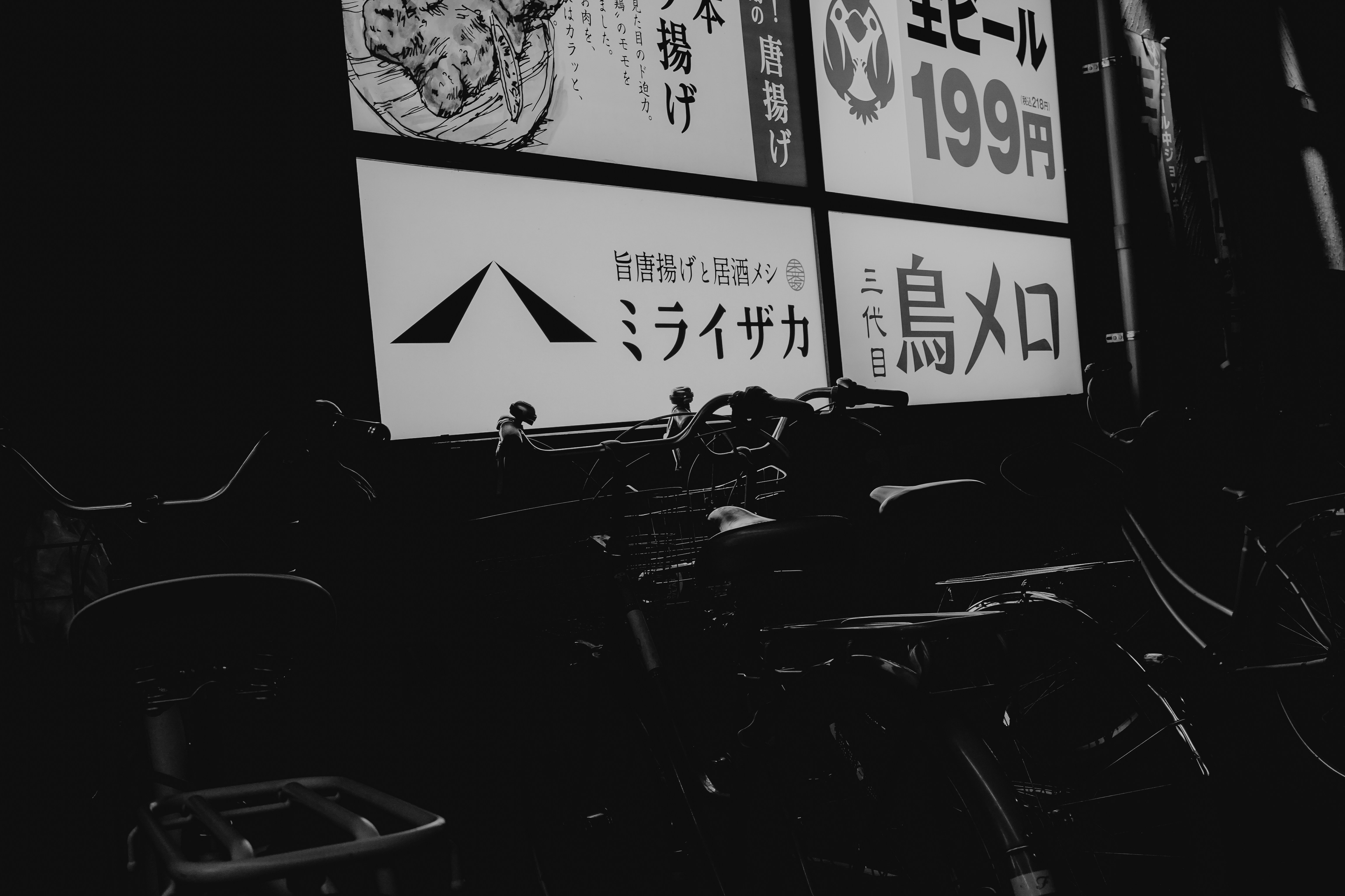 Urban Nightscape: A Tapestry of Shadows and Signage