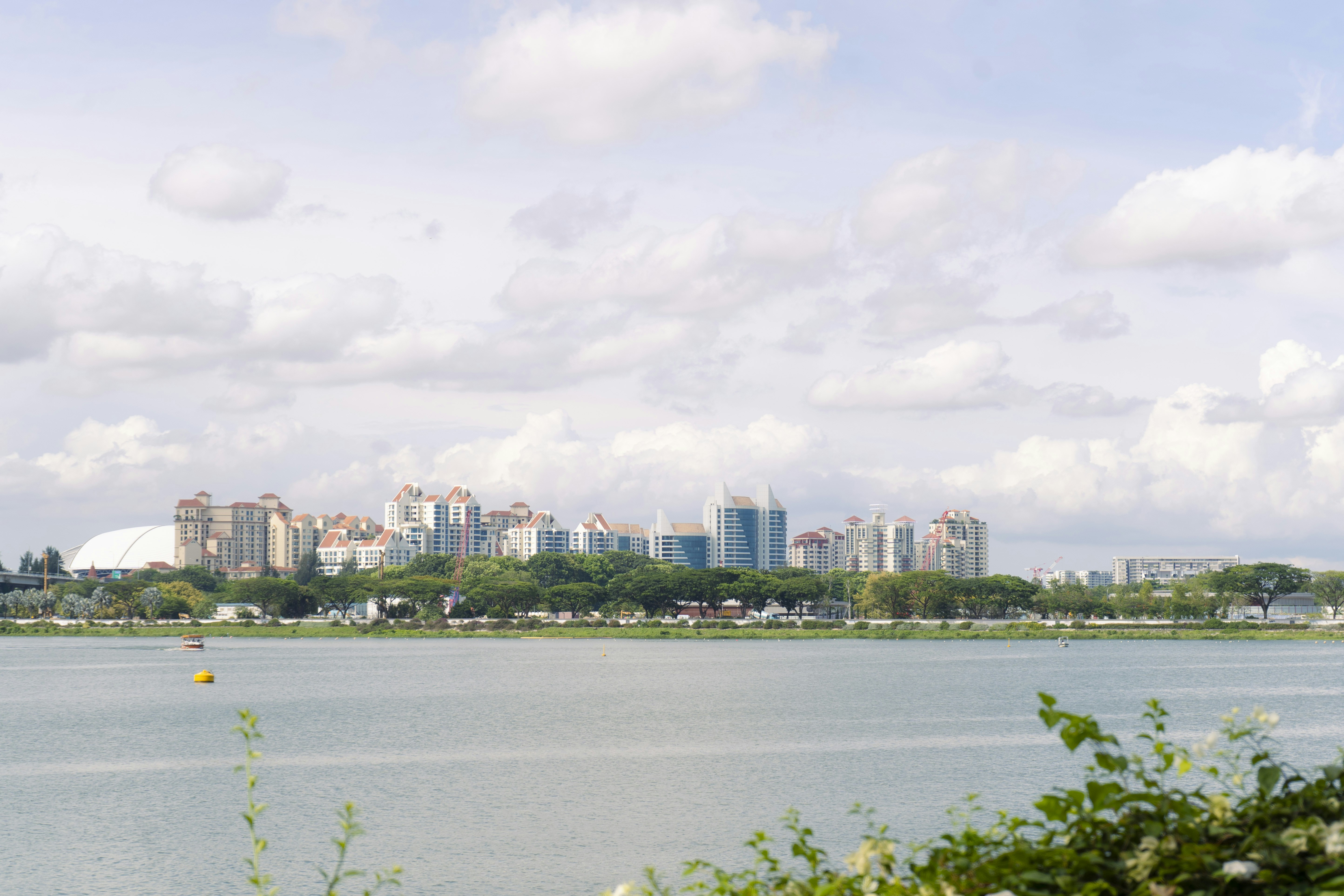 City skyline across a wide body of water.