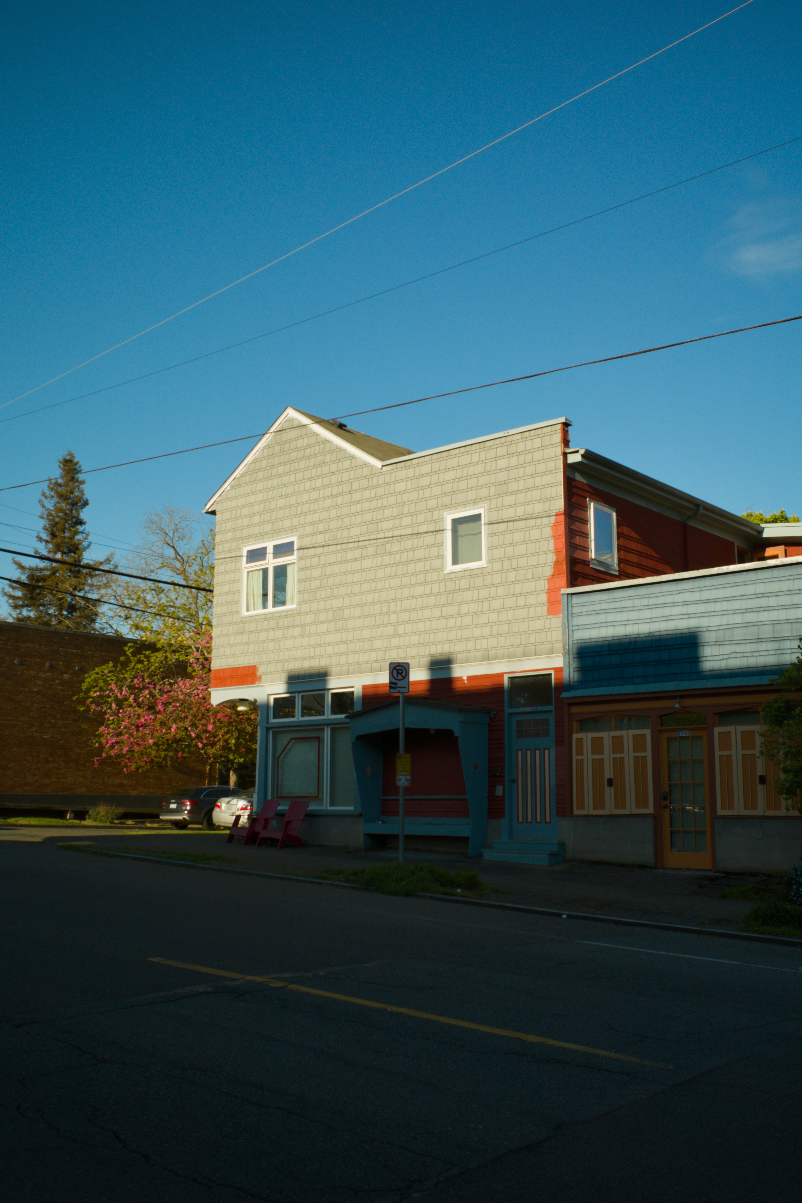 Buildings with colorful facades line a street.