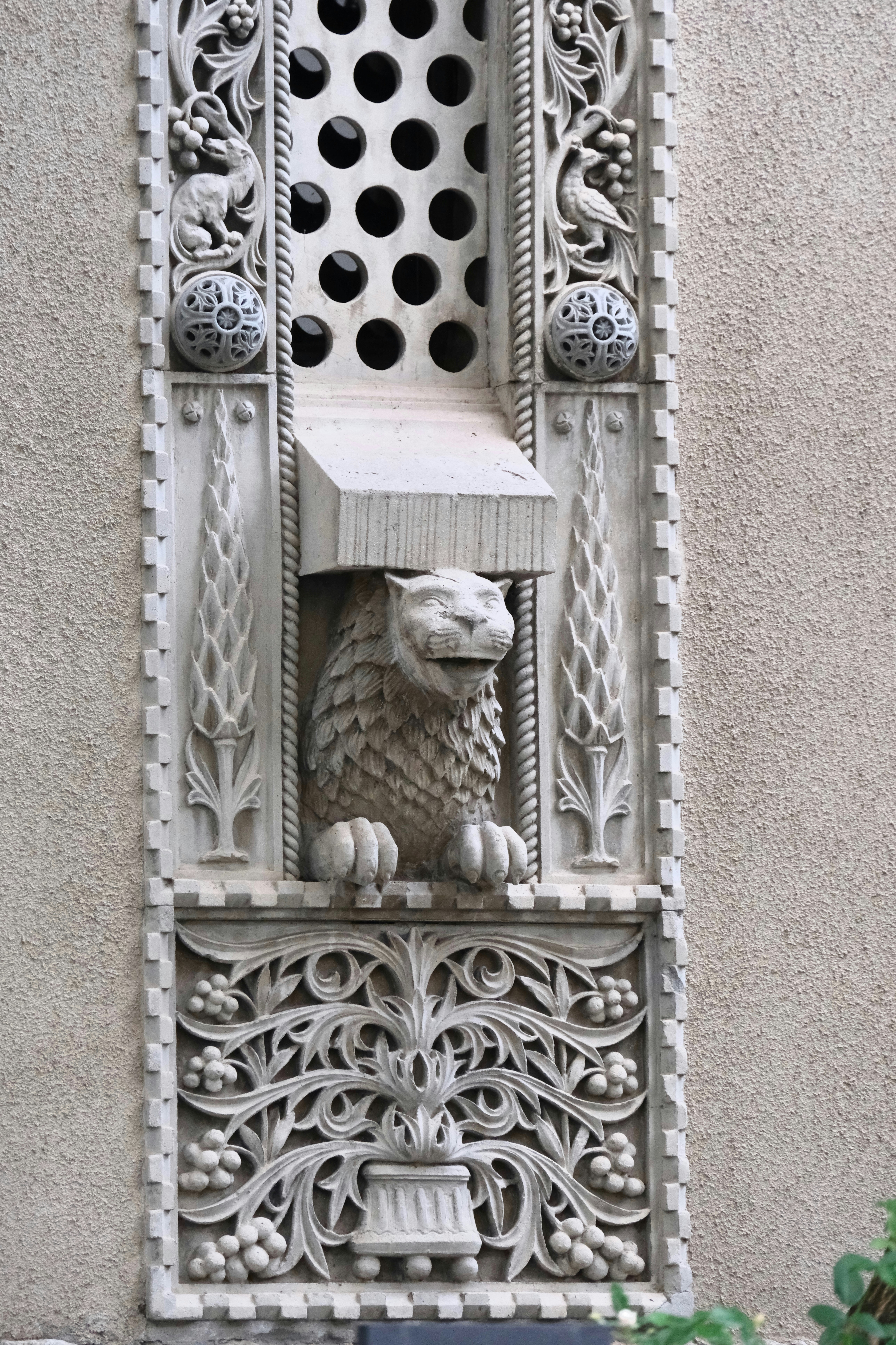 Guardian of the Facade: A Stone Lion's Watch