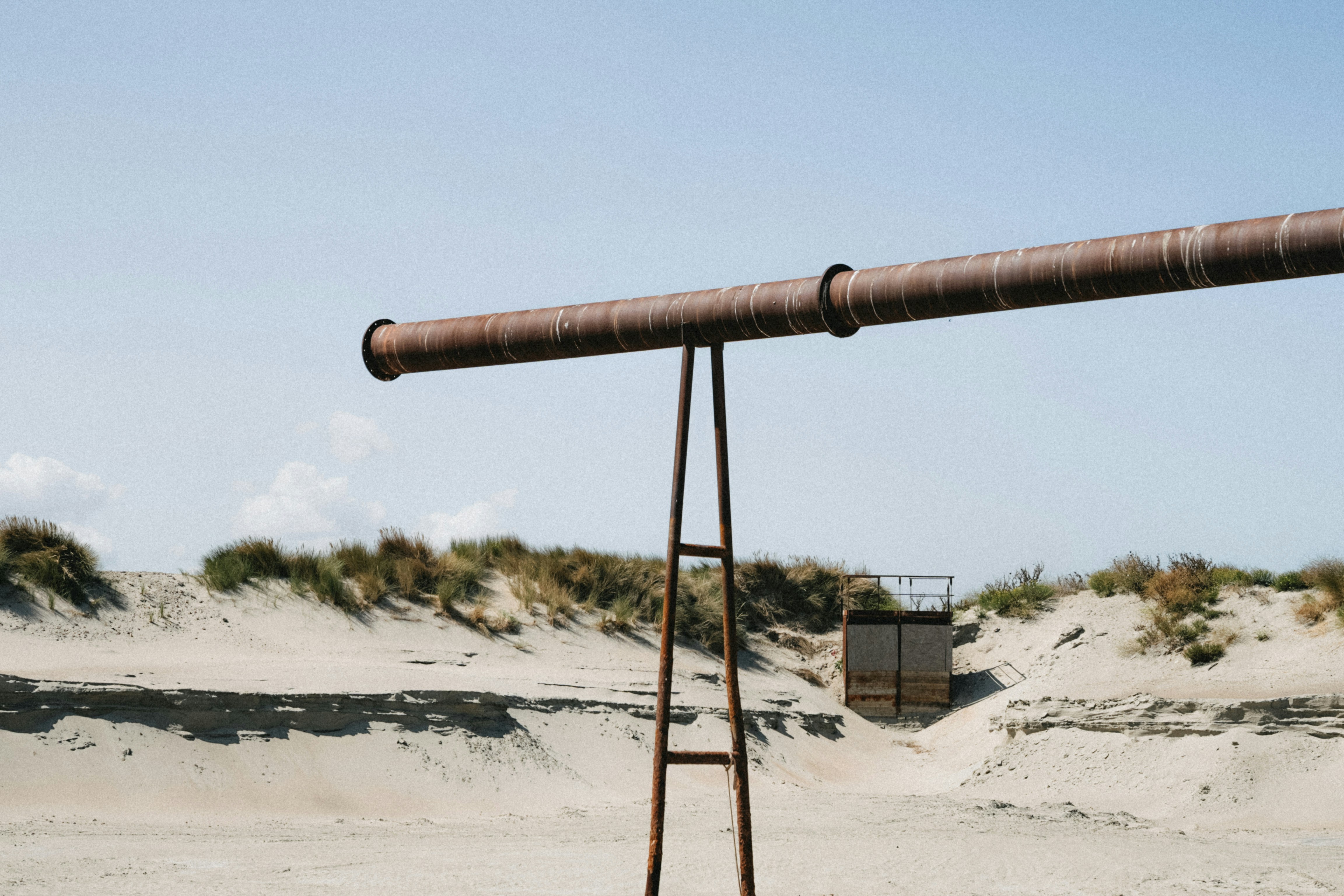 Rust-Lined Pipeline Carves a Line Across Desert Silence