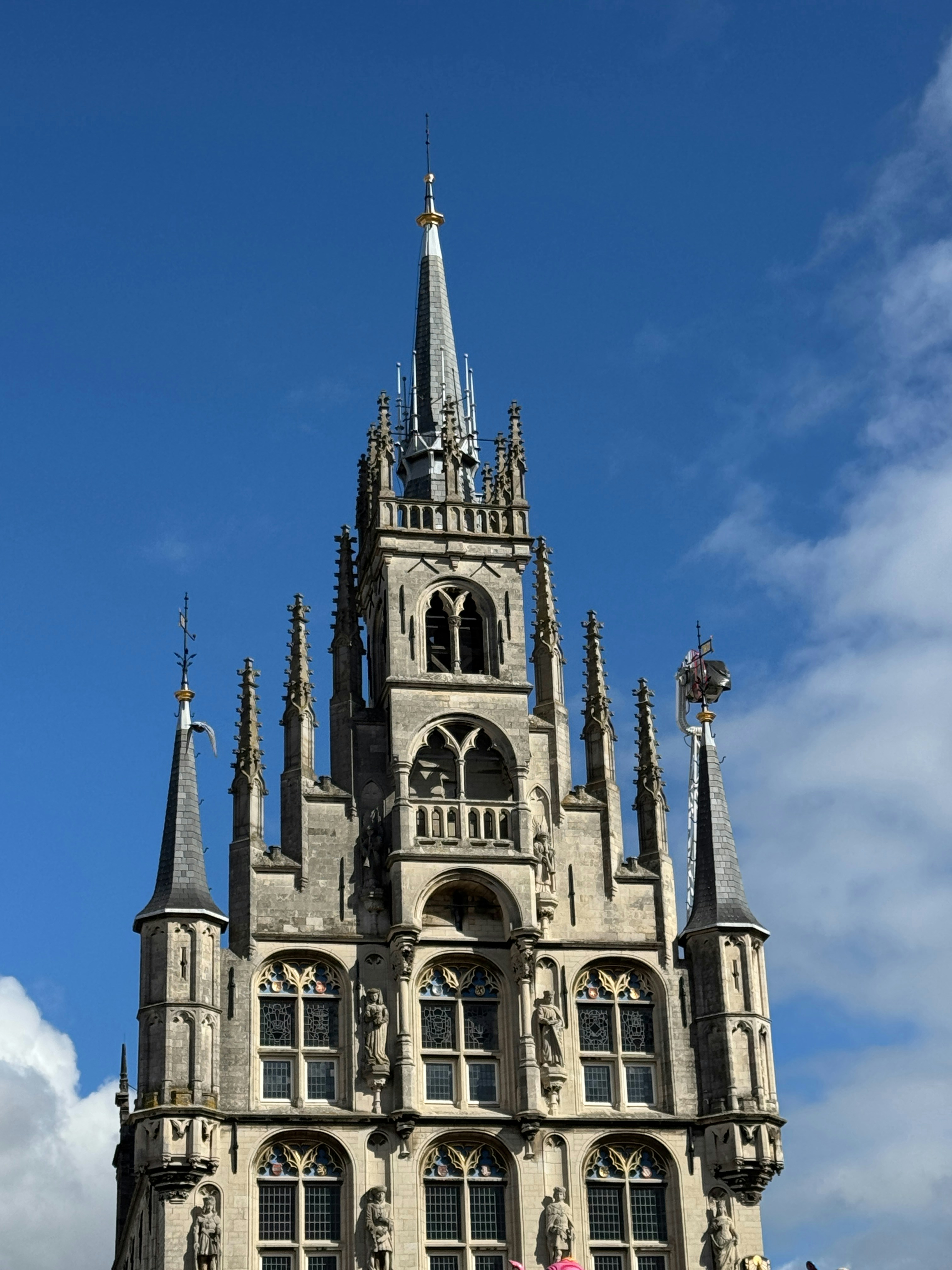 Gothic architecture building against a blue sky.