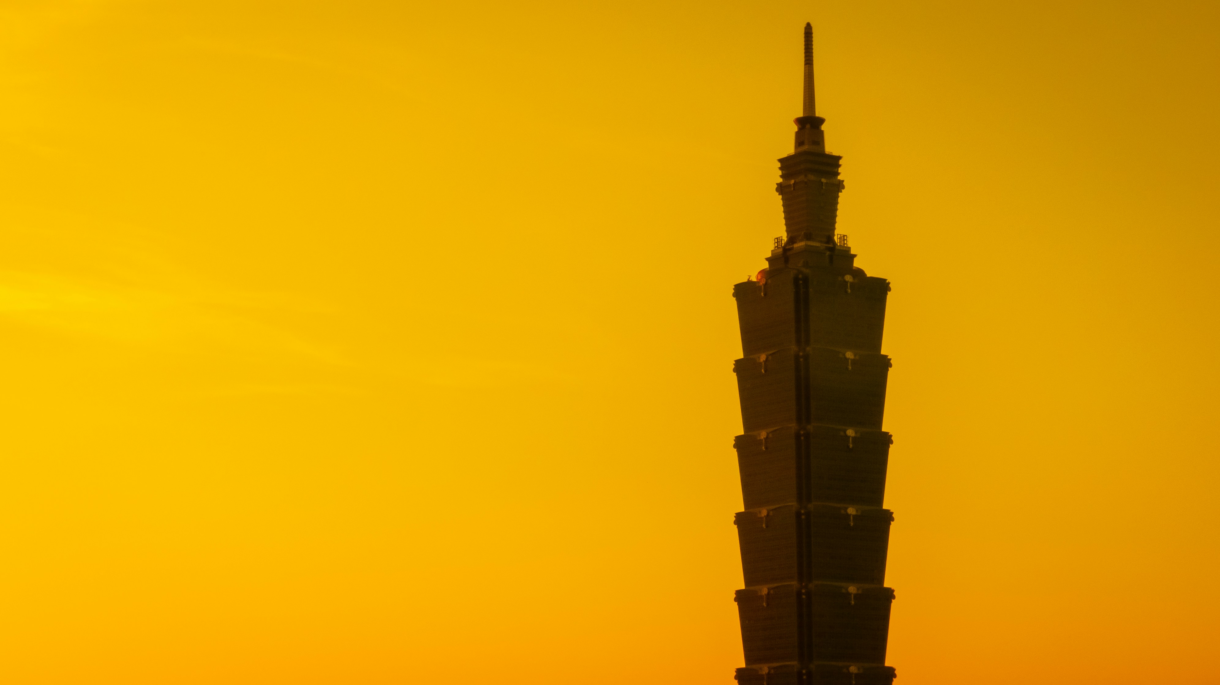 Silhouette of Progress Against a Golden Horizon