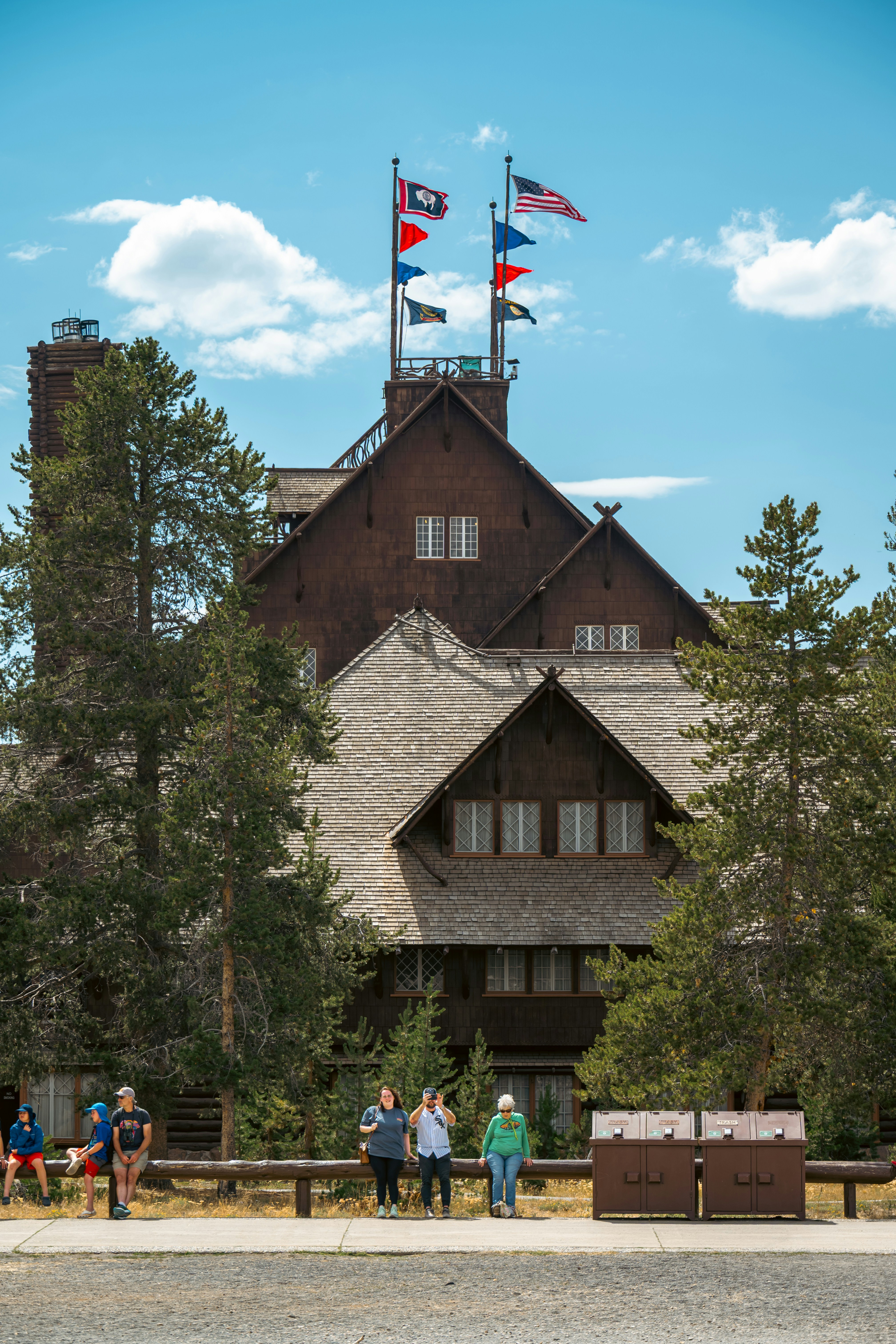 Large wooden lodge with flags flying on roof