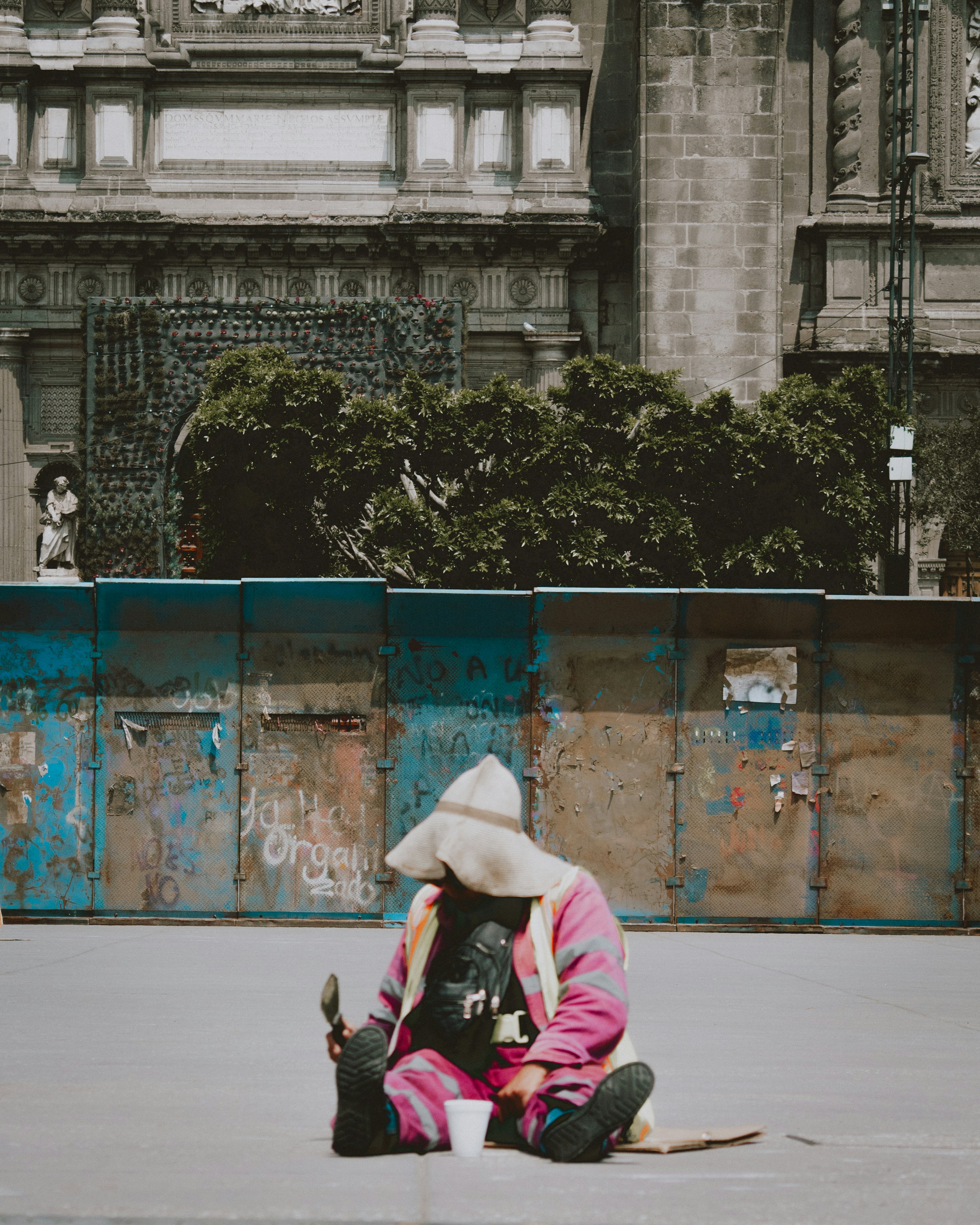 Trabajadora Zocalo | Person in traditional clothing sitting on street