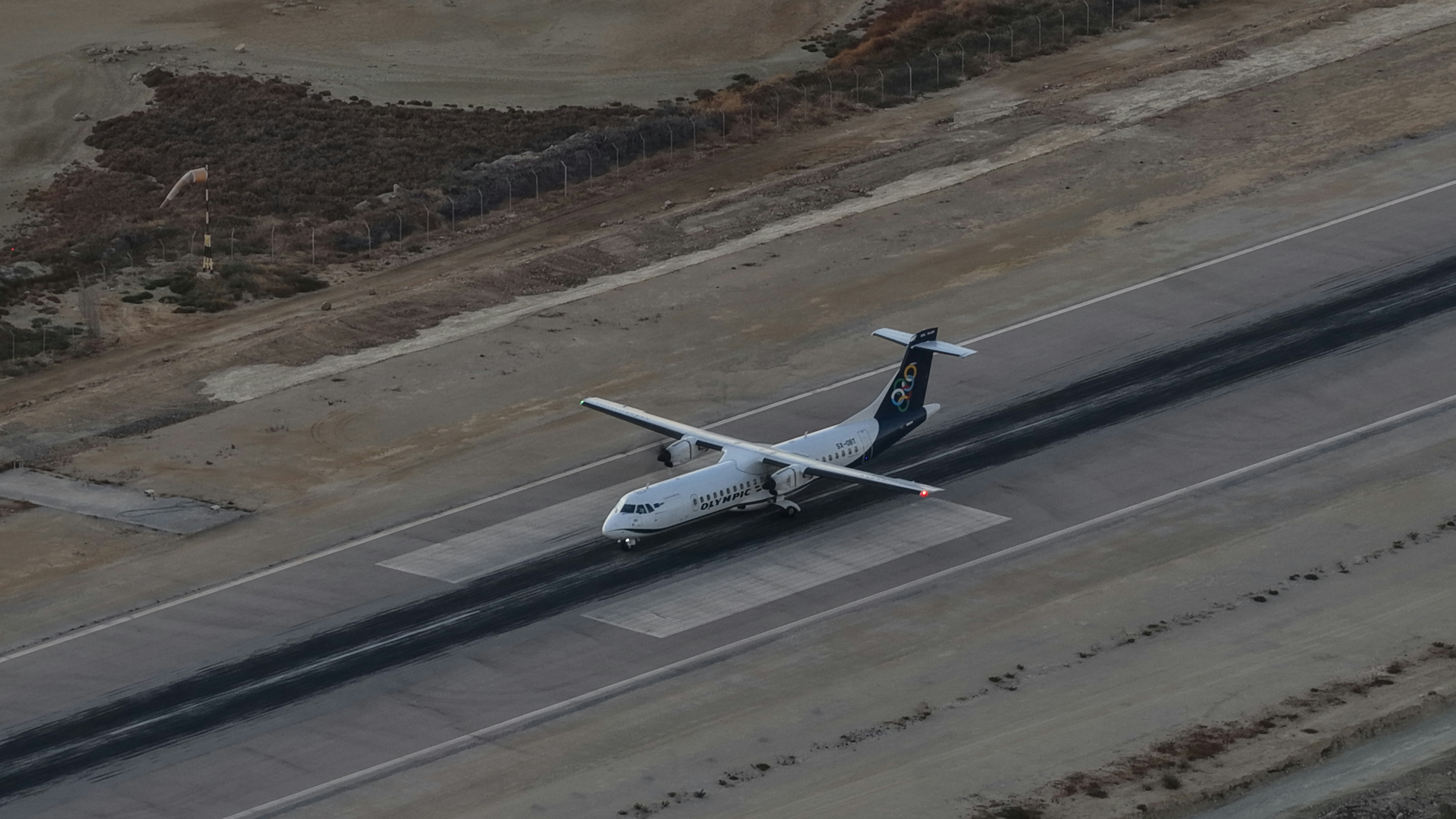 Airplane on a runway at an airport.