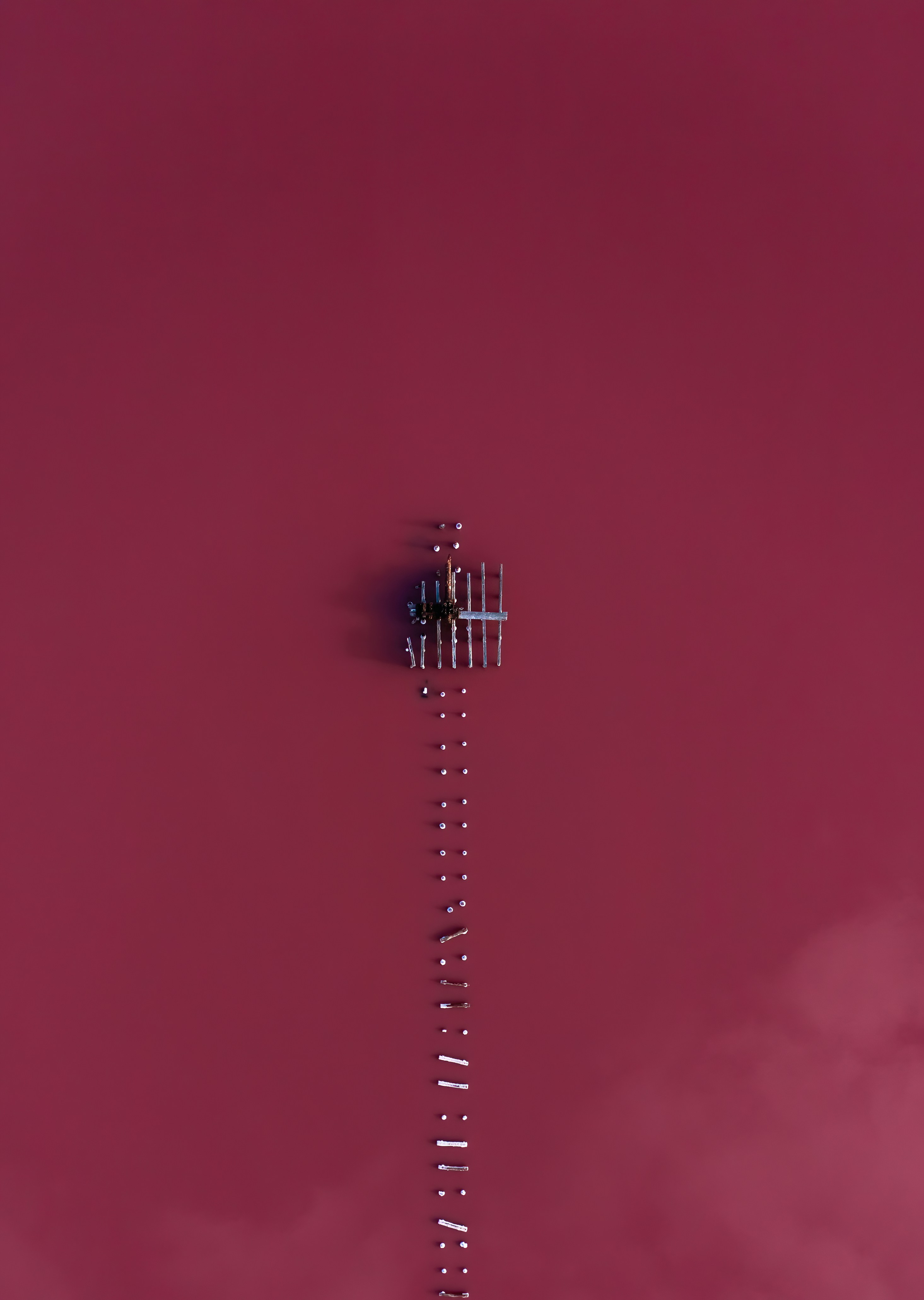 Crimson Reflections: A Pier's Solitude