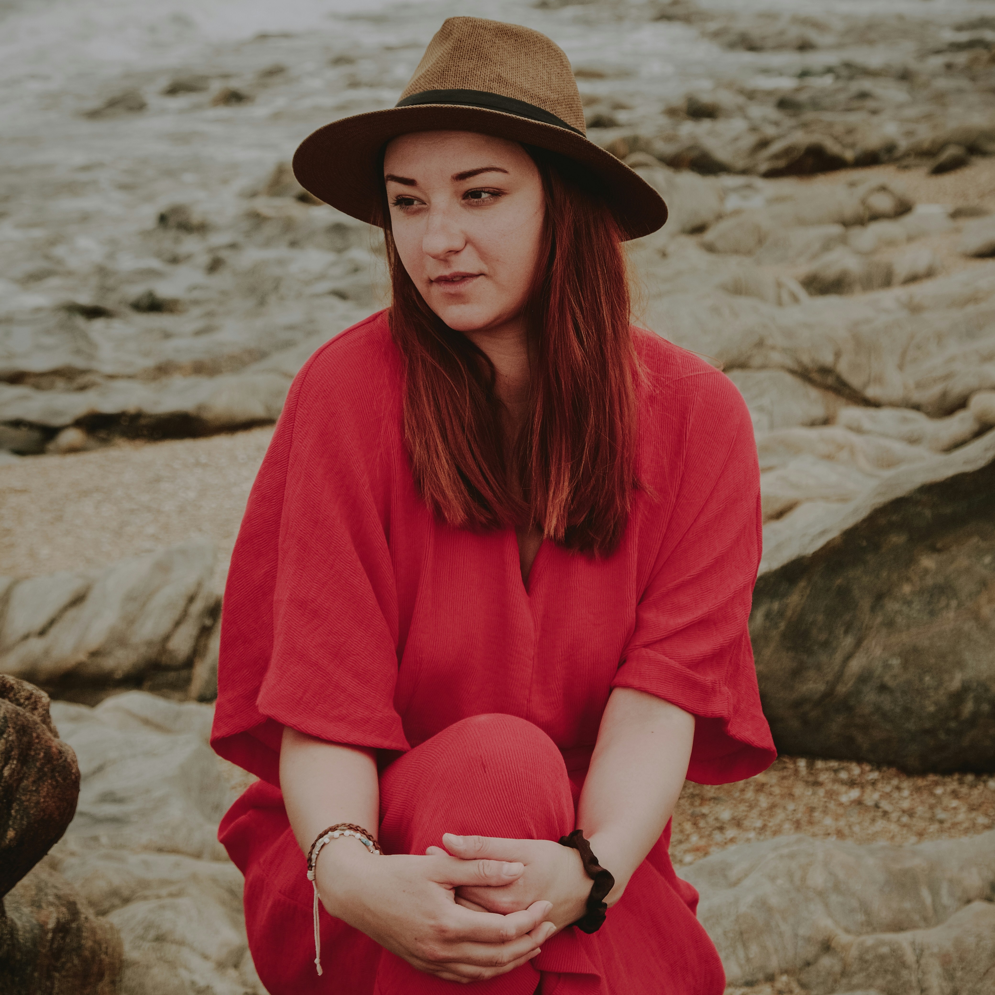 Serenity in Scarlet: A Moment by the Shore
