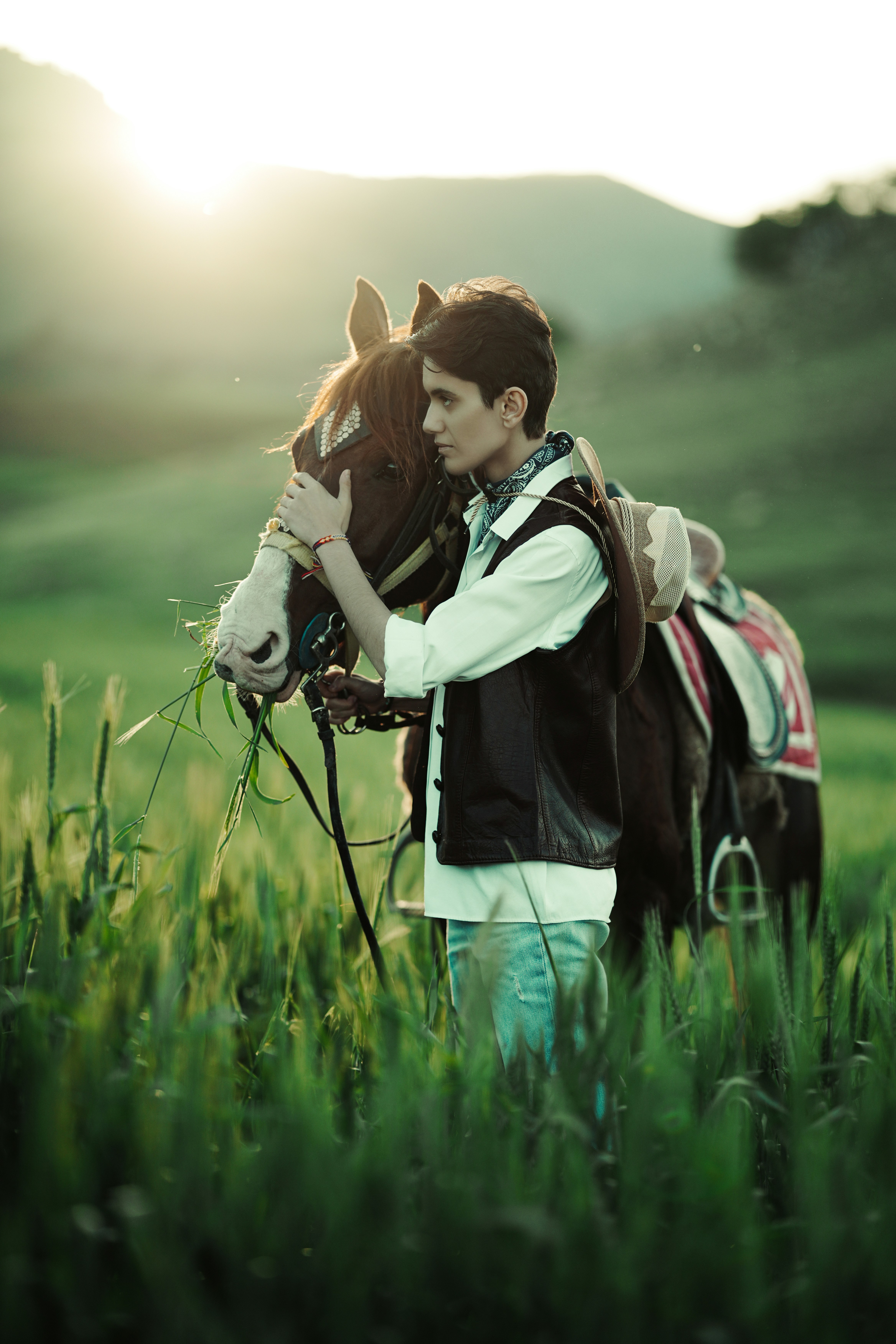 Whispers in the Field: A Quiet Moment with a Rider and his Horse