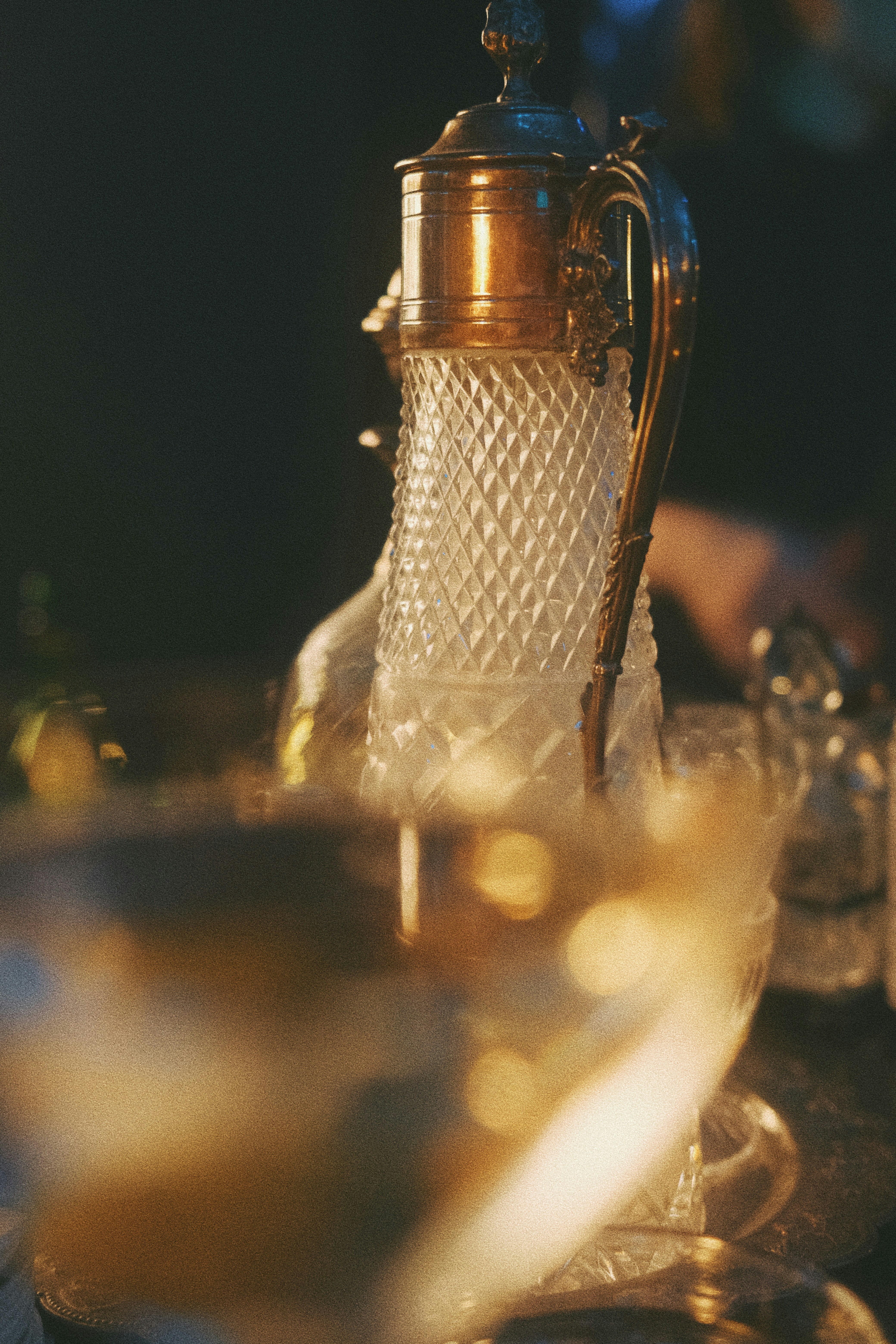 Processed with VSCO with a7 preset | Ornate crystal pitcher with gold accents on table