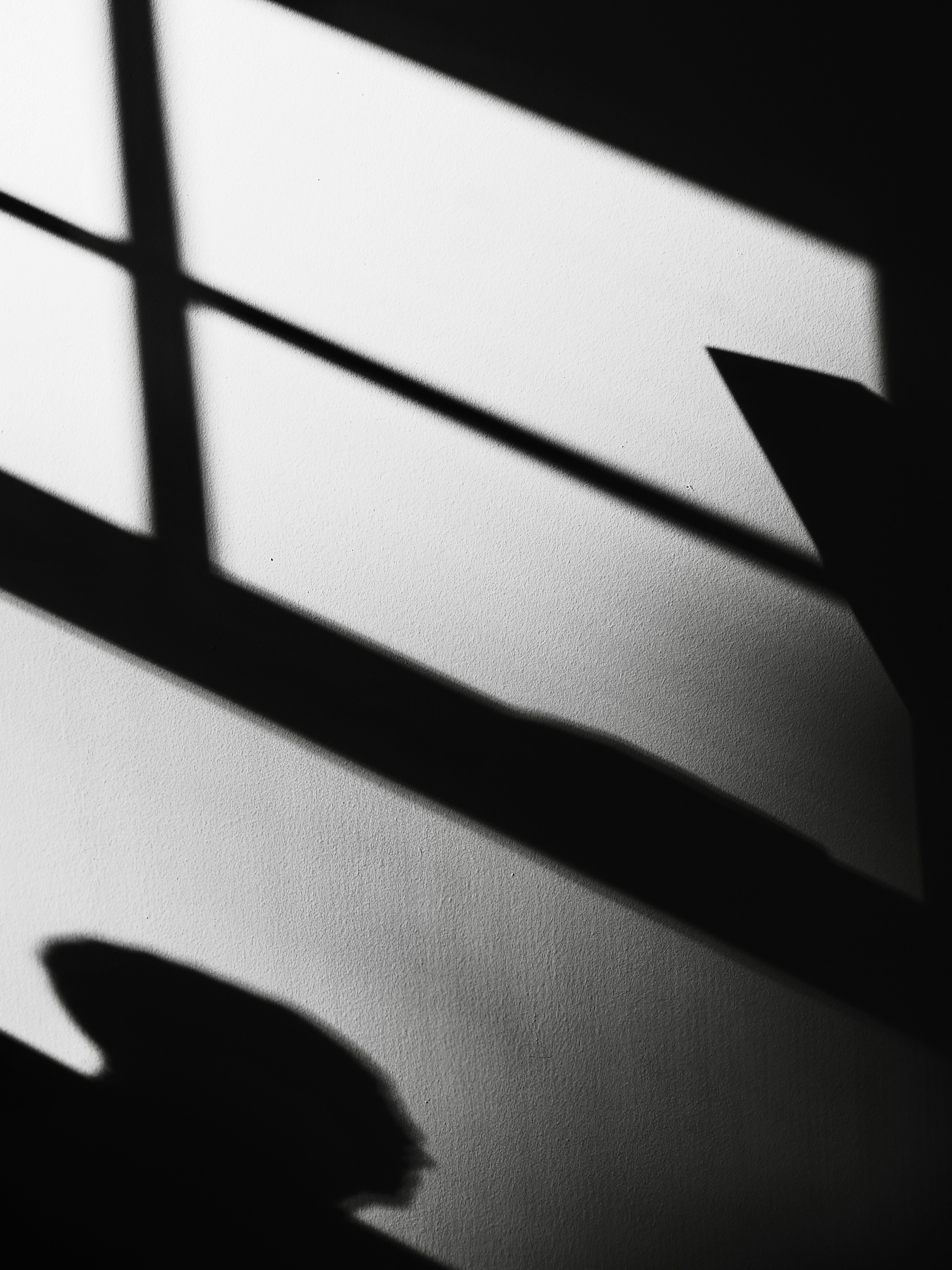 Shadow play | Abstract shadows cast by window panes on a wall