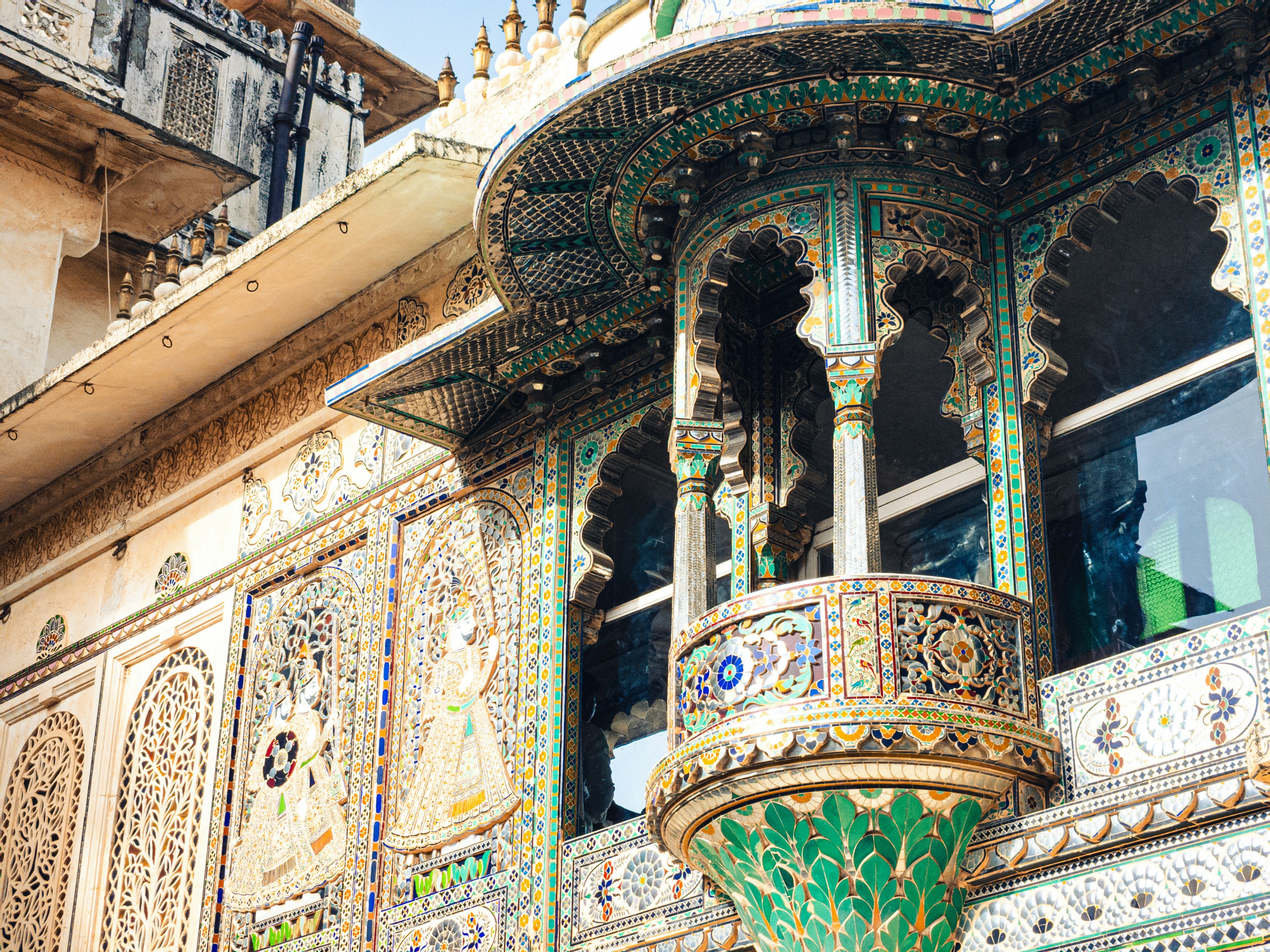 Ornate balcony on a building with intricate details.