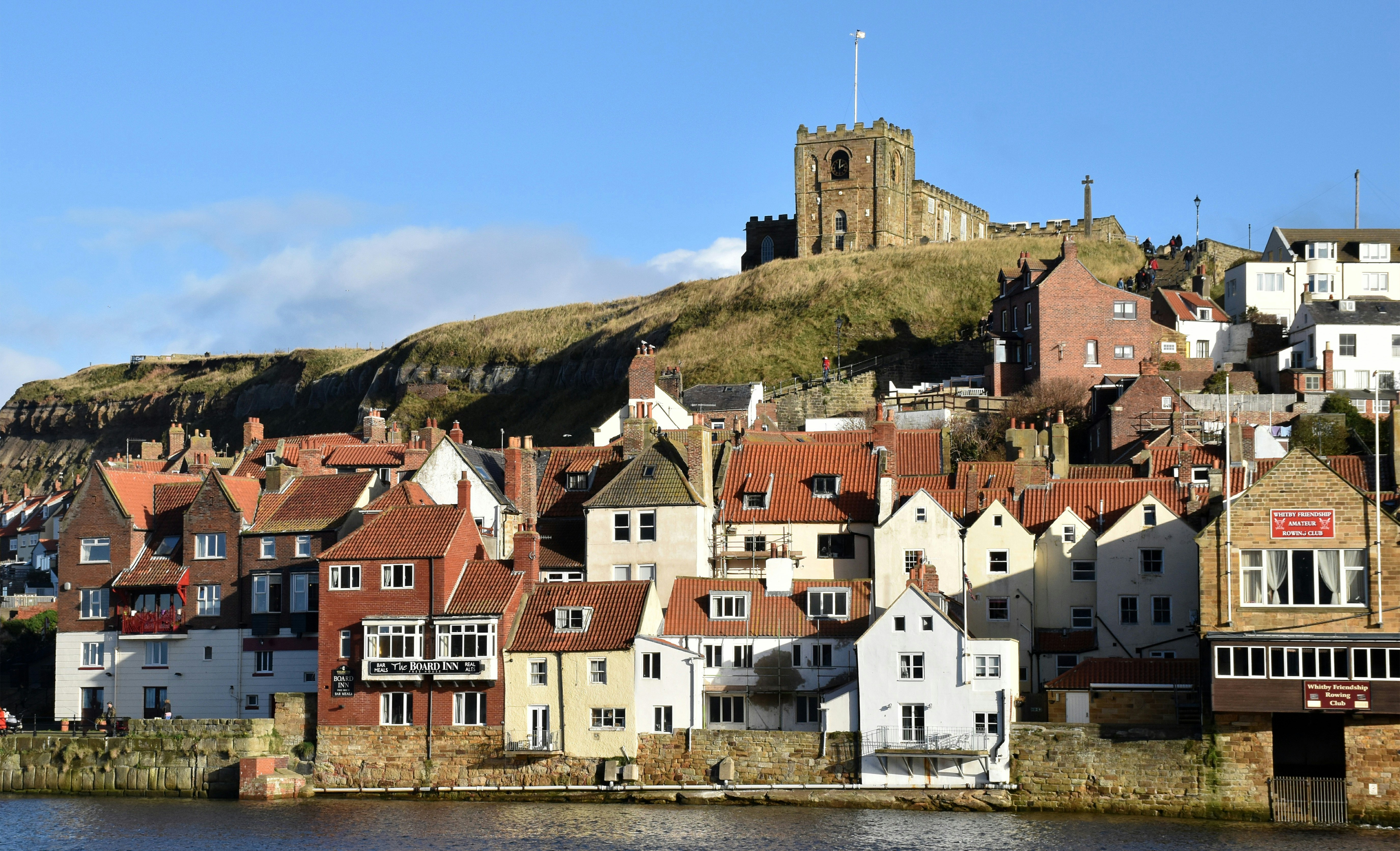Whitby | Coastal town with historic church on hill