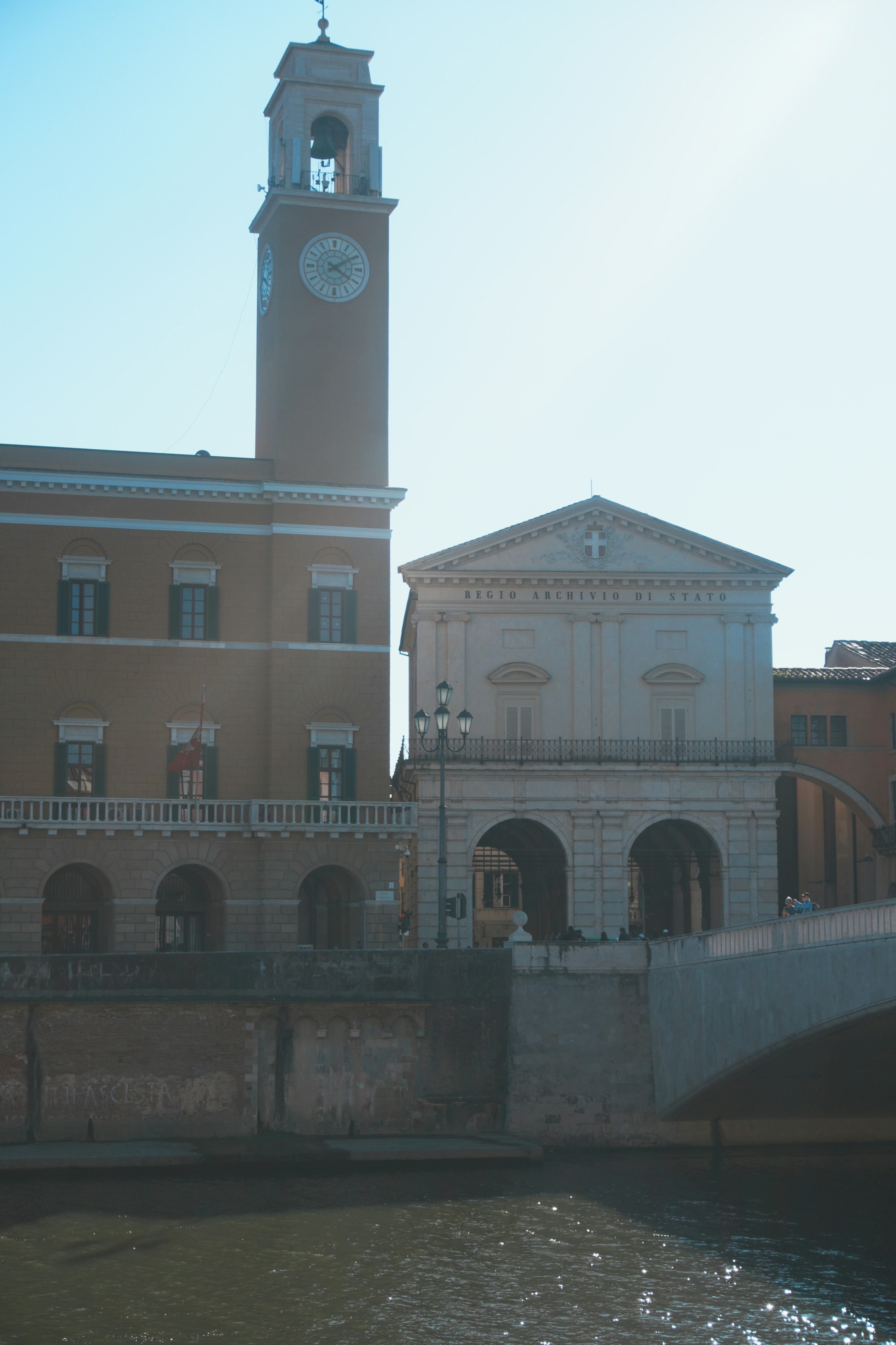 Clock tower and building by a river