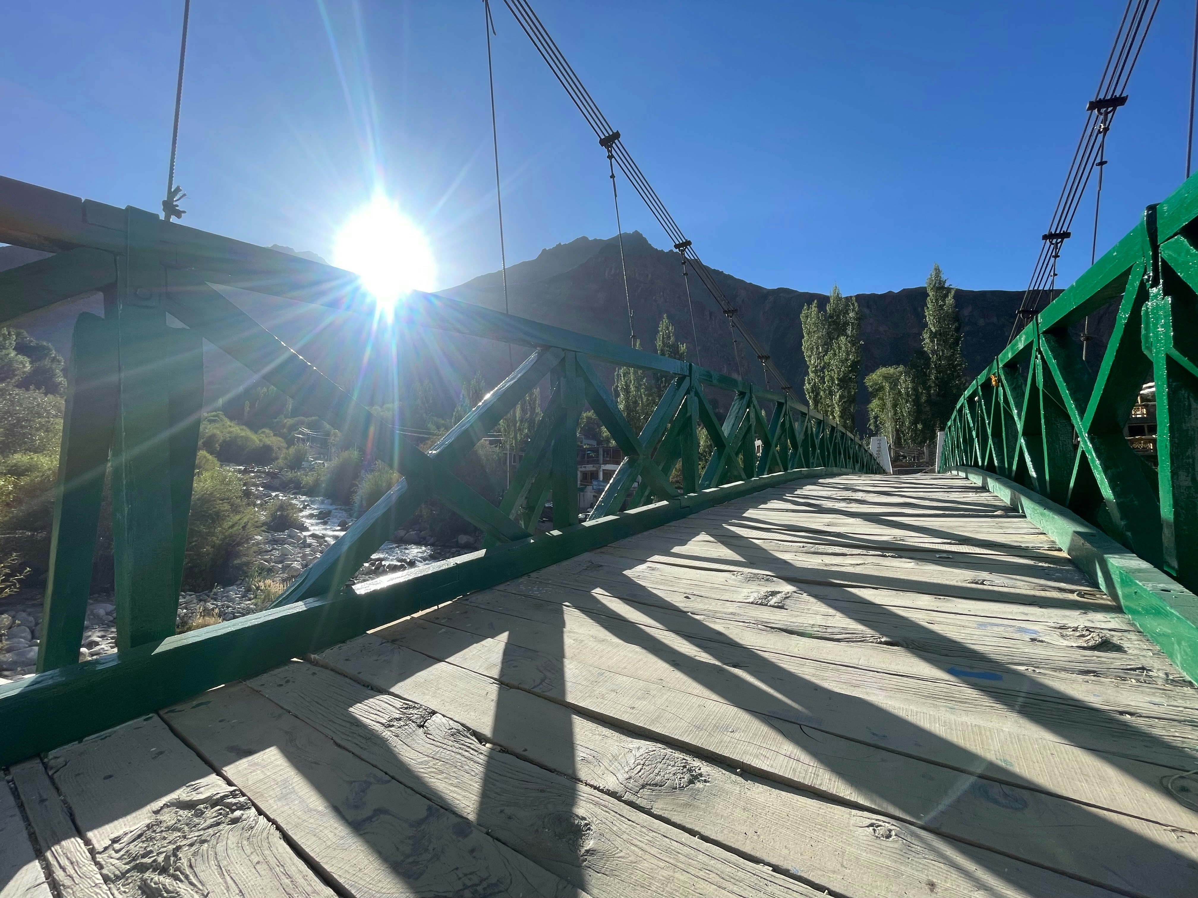 Sunlit Pathway Over the River