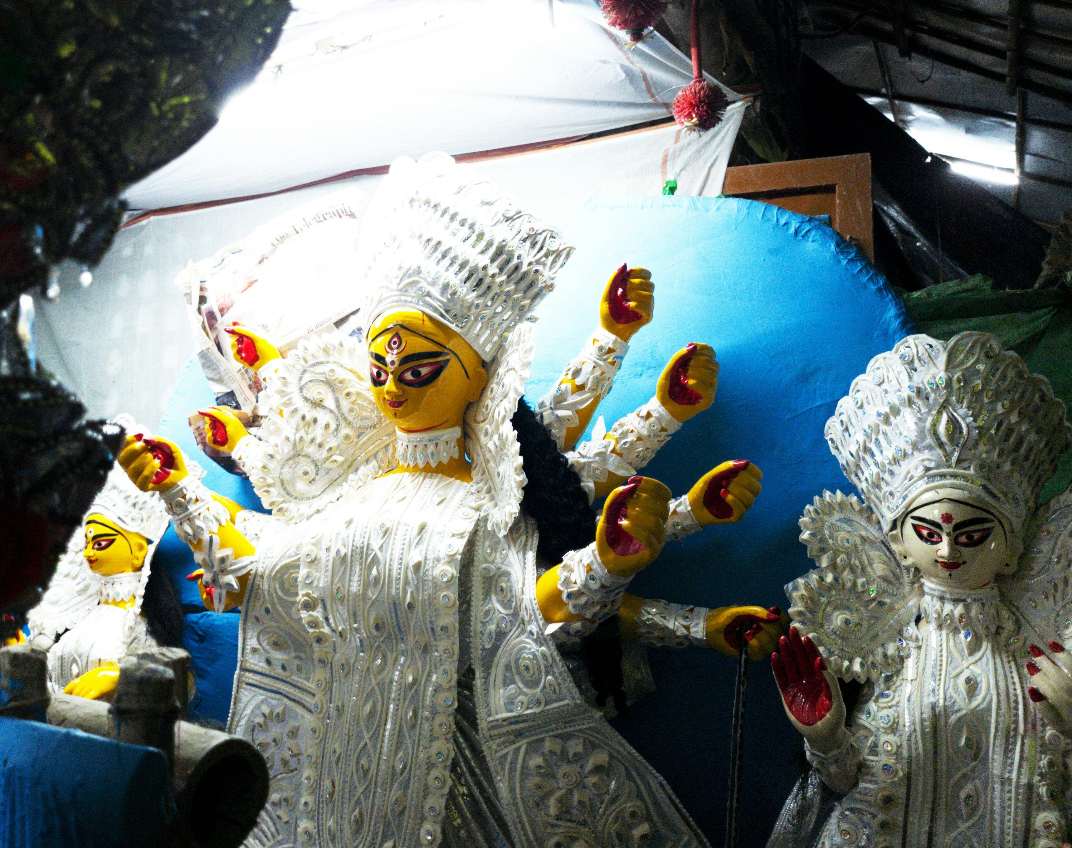 Two hindu goddess durga idols in white attire