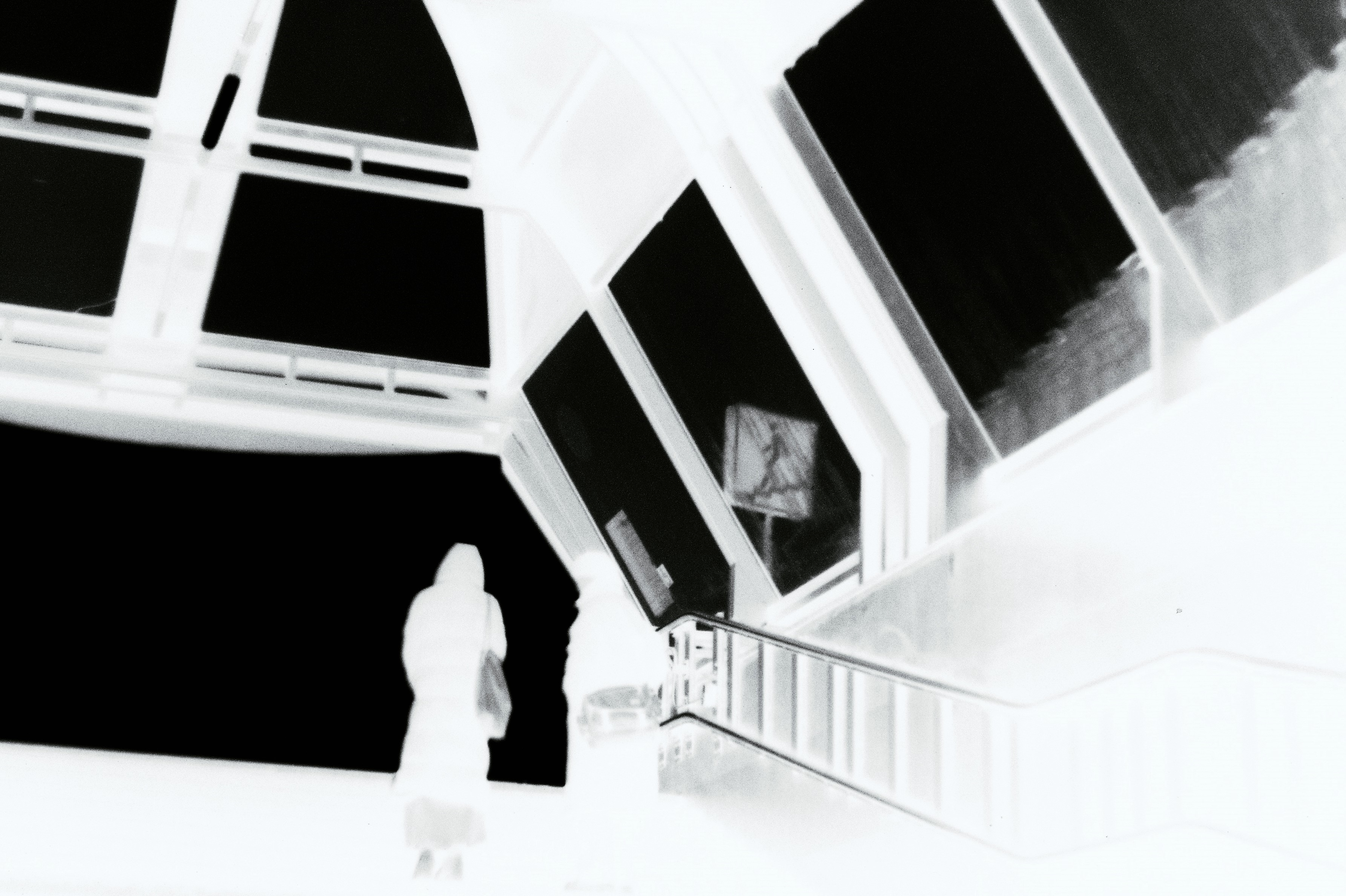 Person walking up stairs in modern architecture