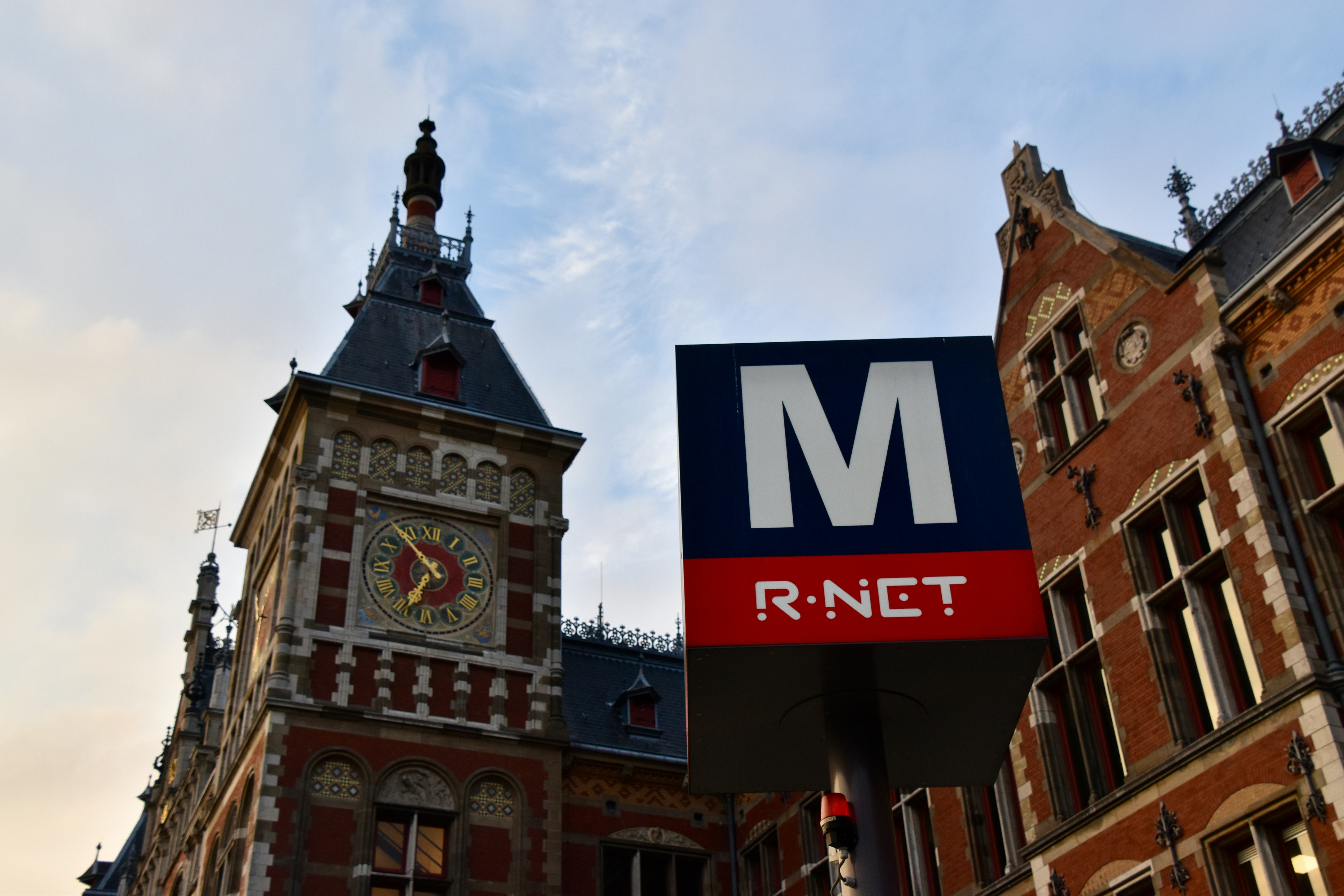 Historic building with clock tower and r-net sign