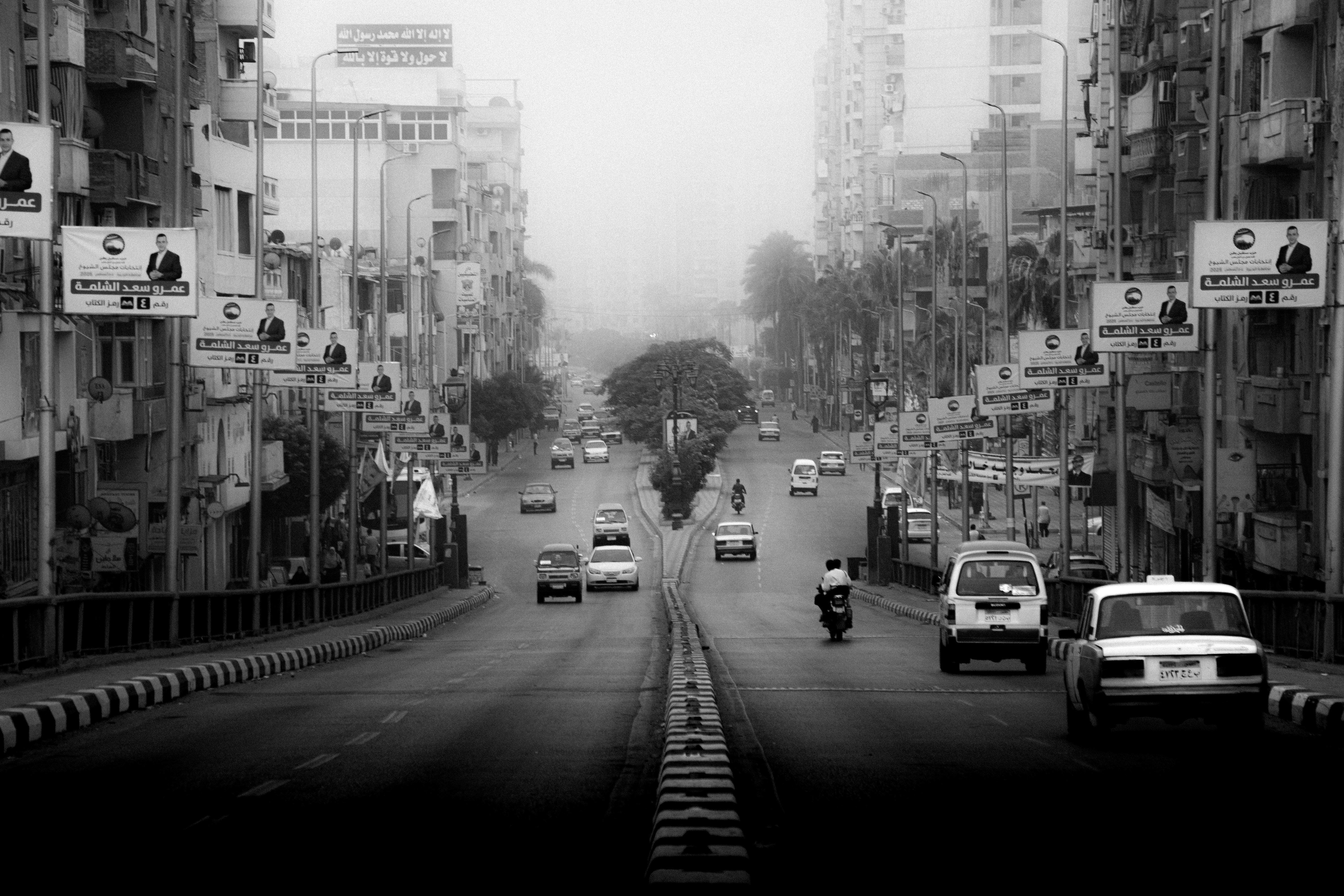 Foggy morning | Cars and motorcycle on a foggy city street.