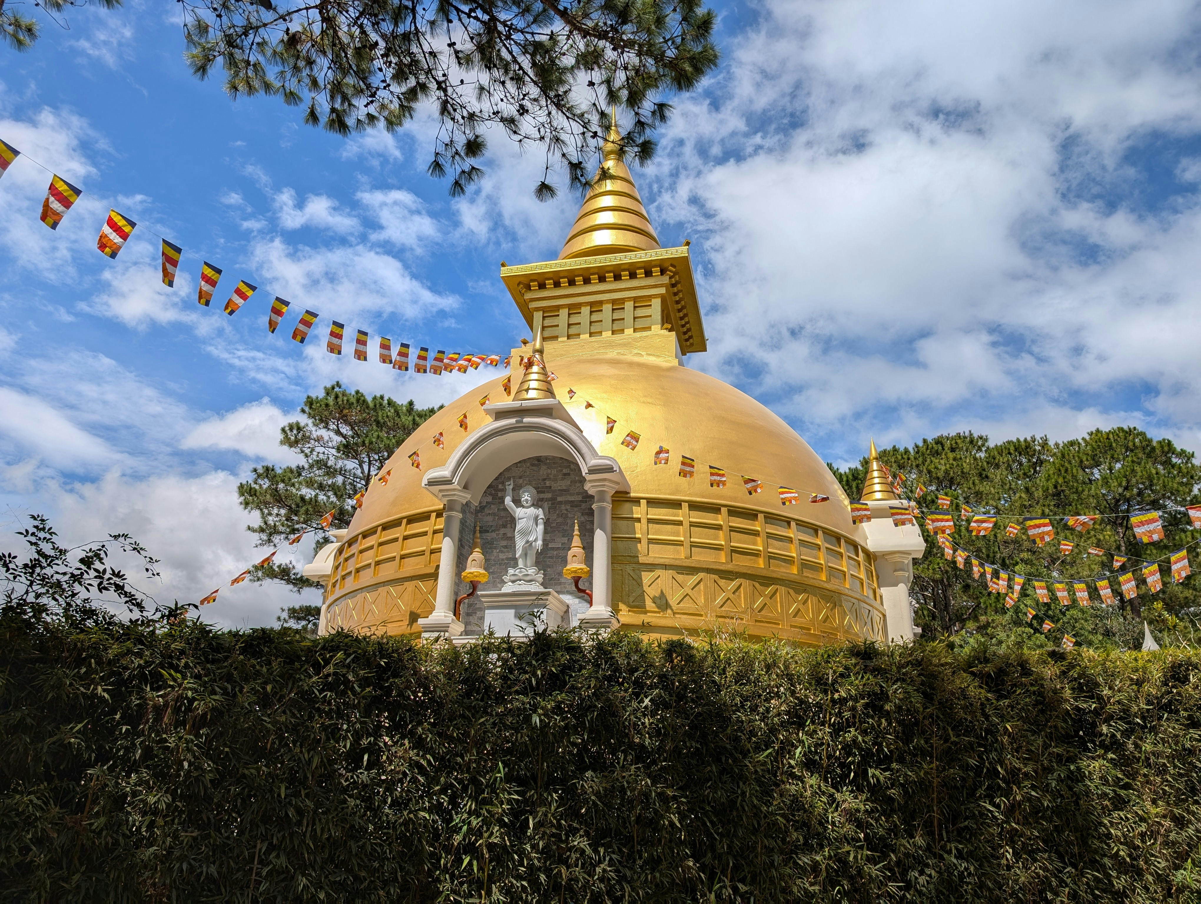 Golden Serenity: A Stupa Amidst Nature's Embrace