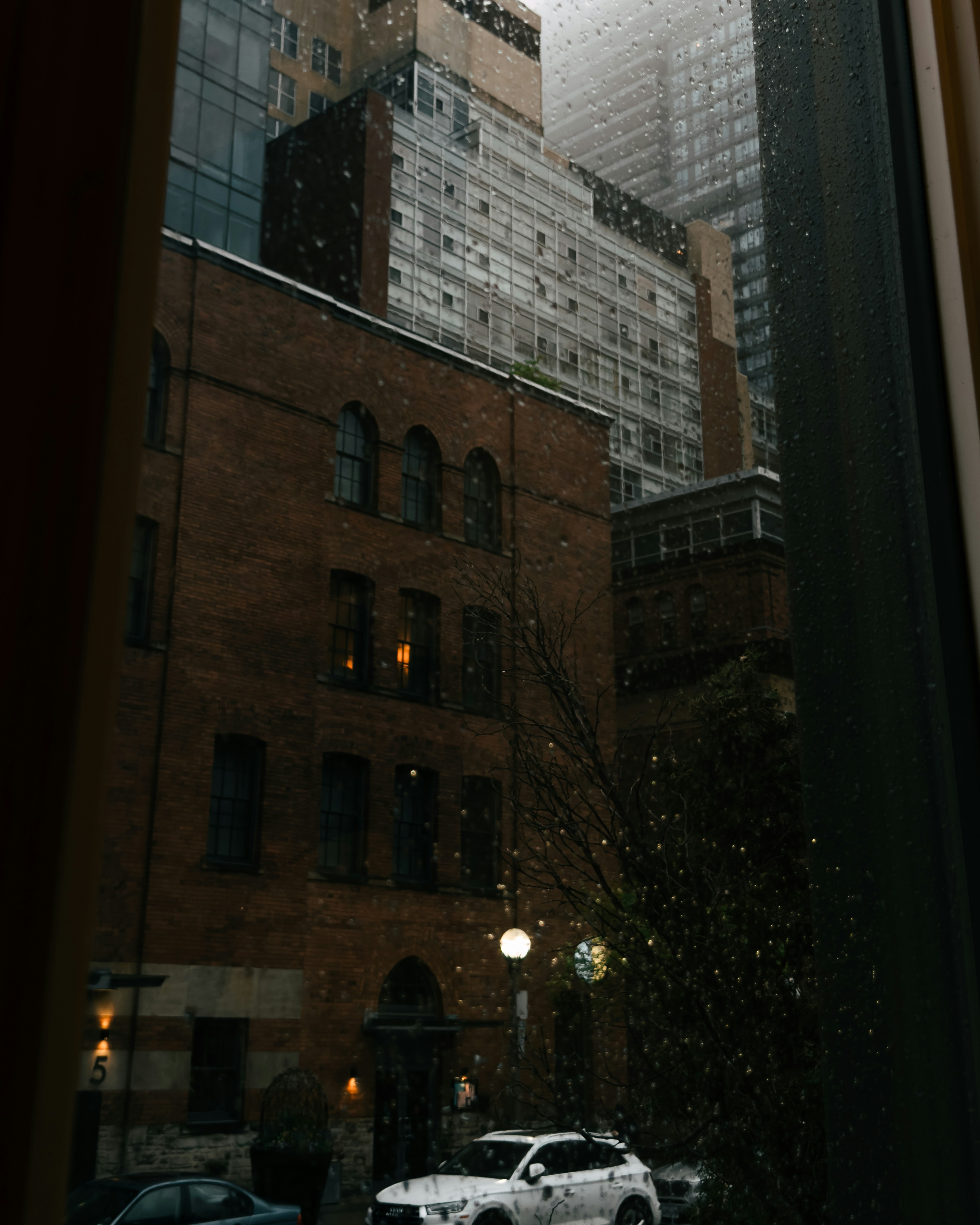 Rainy day in the city with brick buildings.