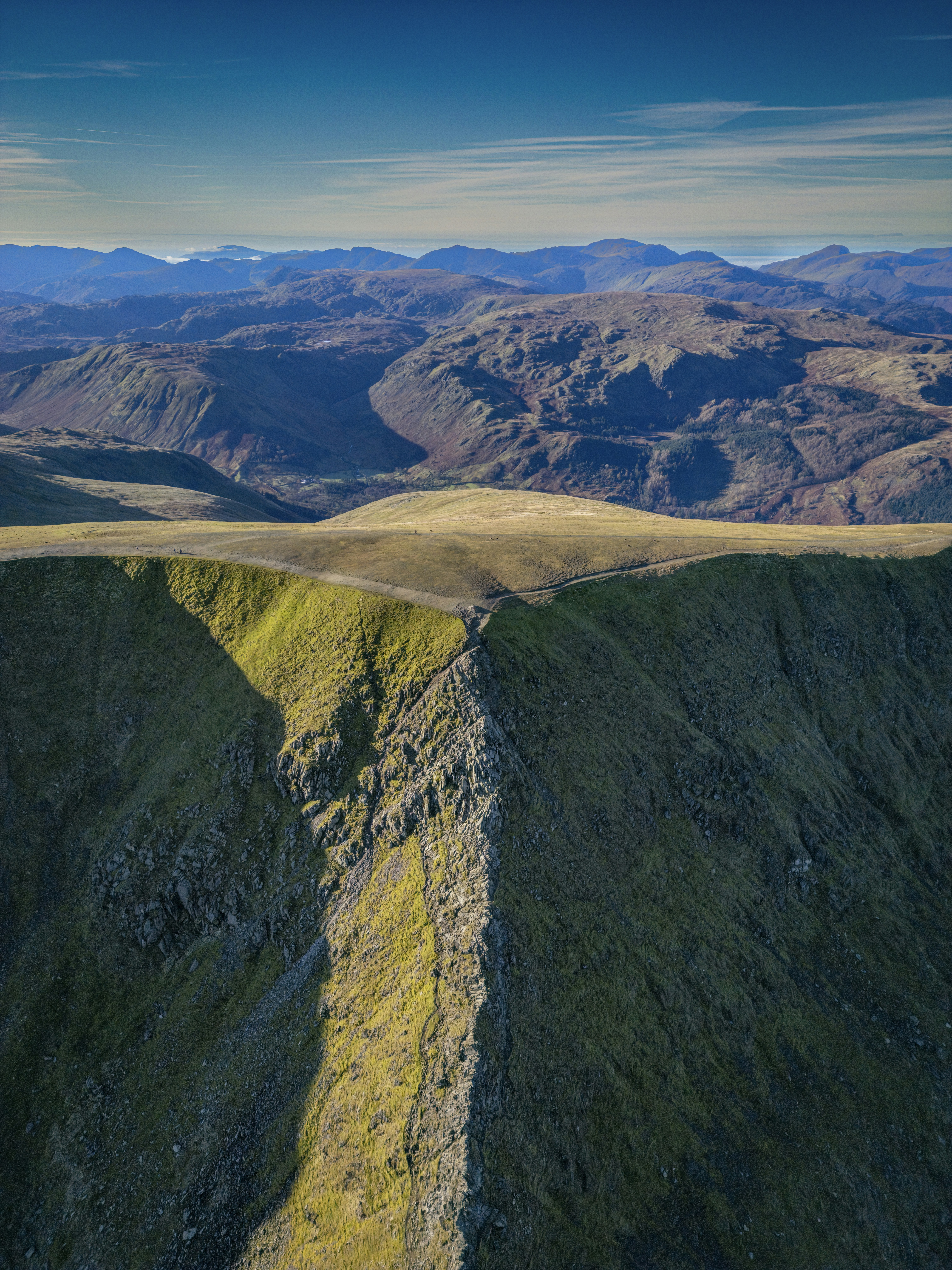 The Ridge's Embrace: A Dance of Light and Shadow