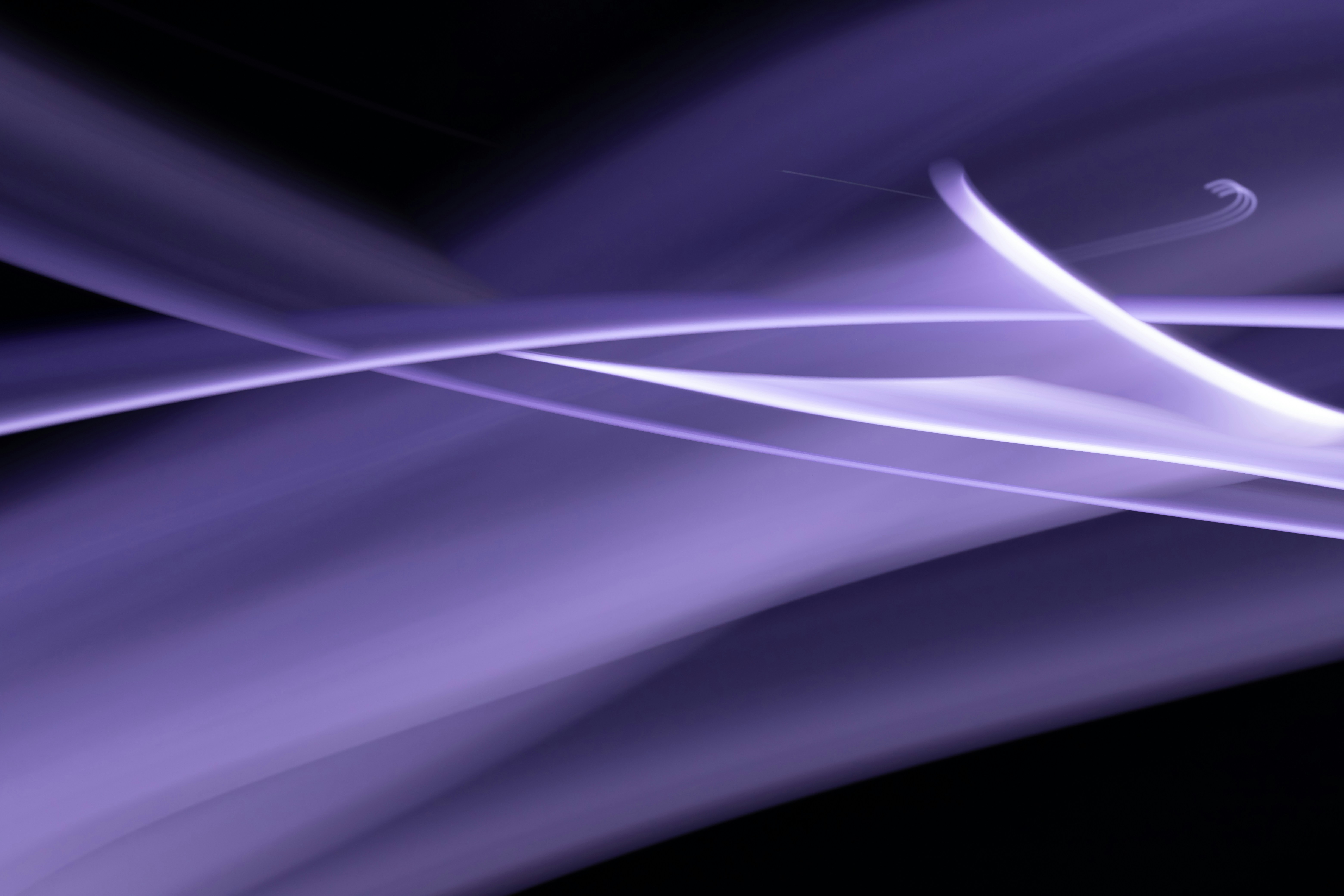 Abstract purple light streaks on black background photo – Free ...
