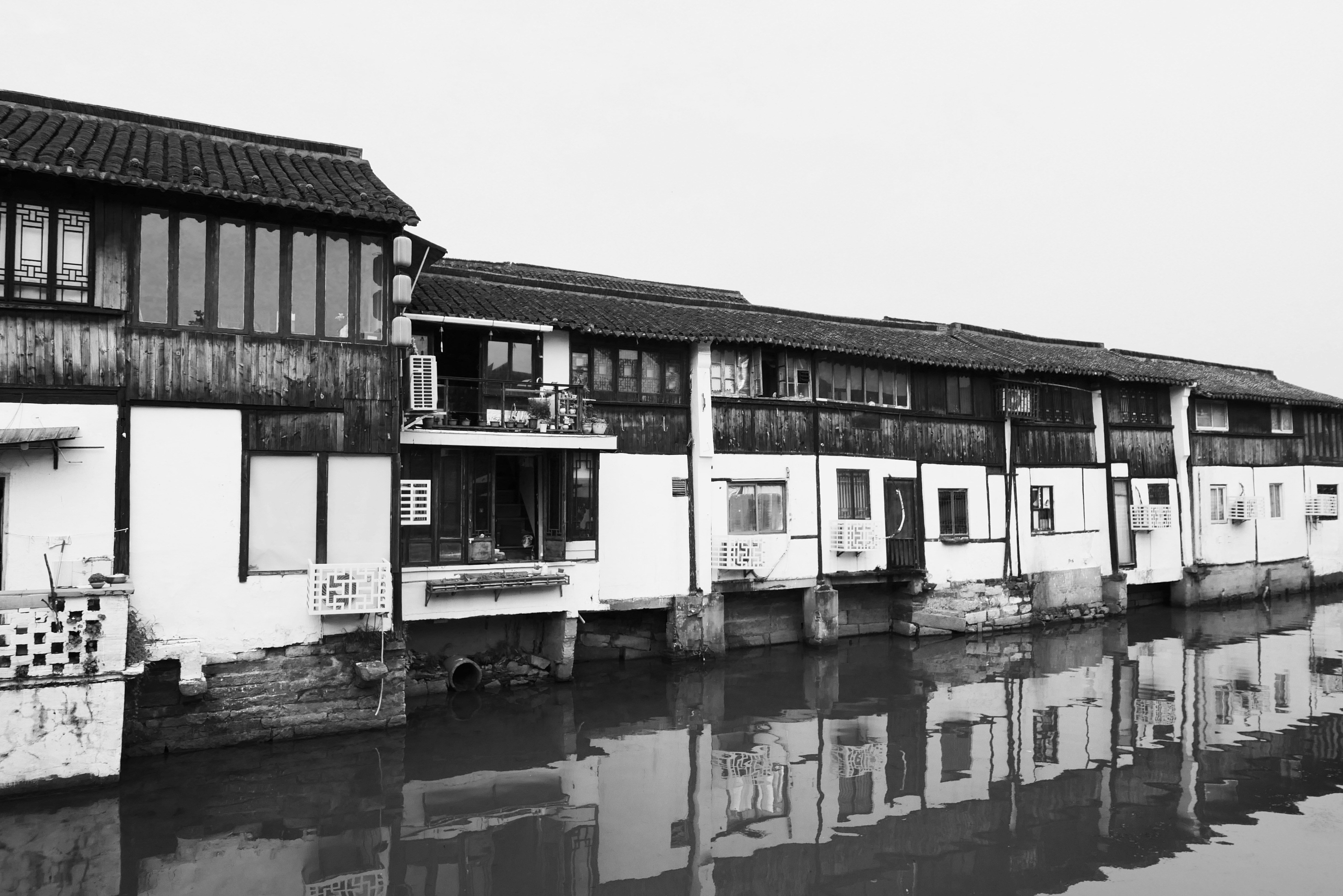 Waterfront Dwellings in Monochrome Tide