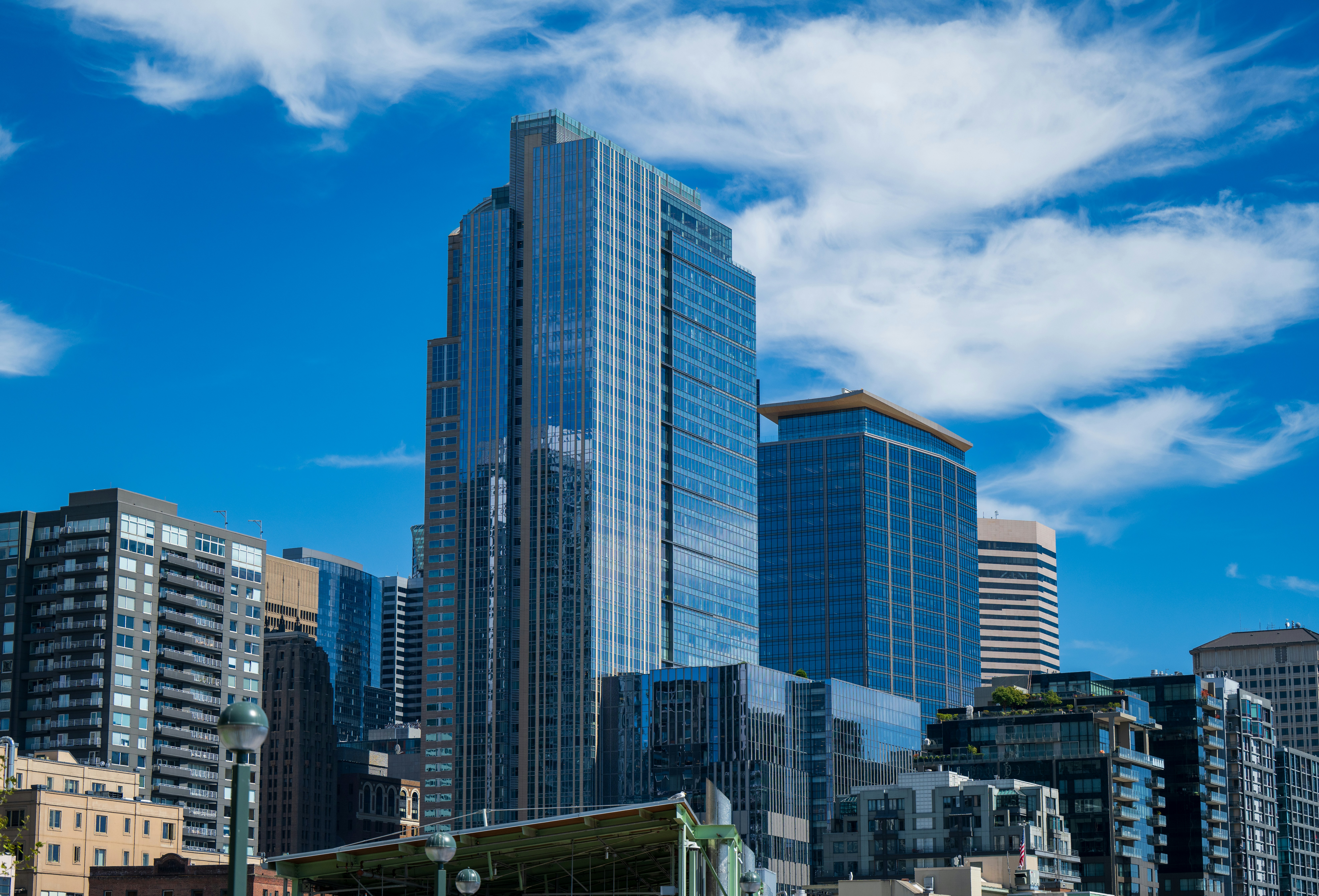Modern skyscrapers in a city under a blue sky