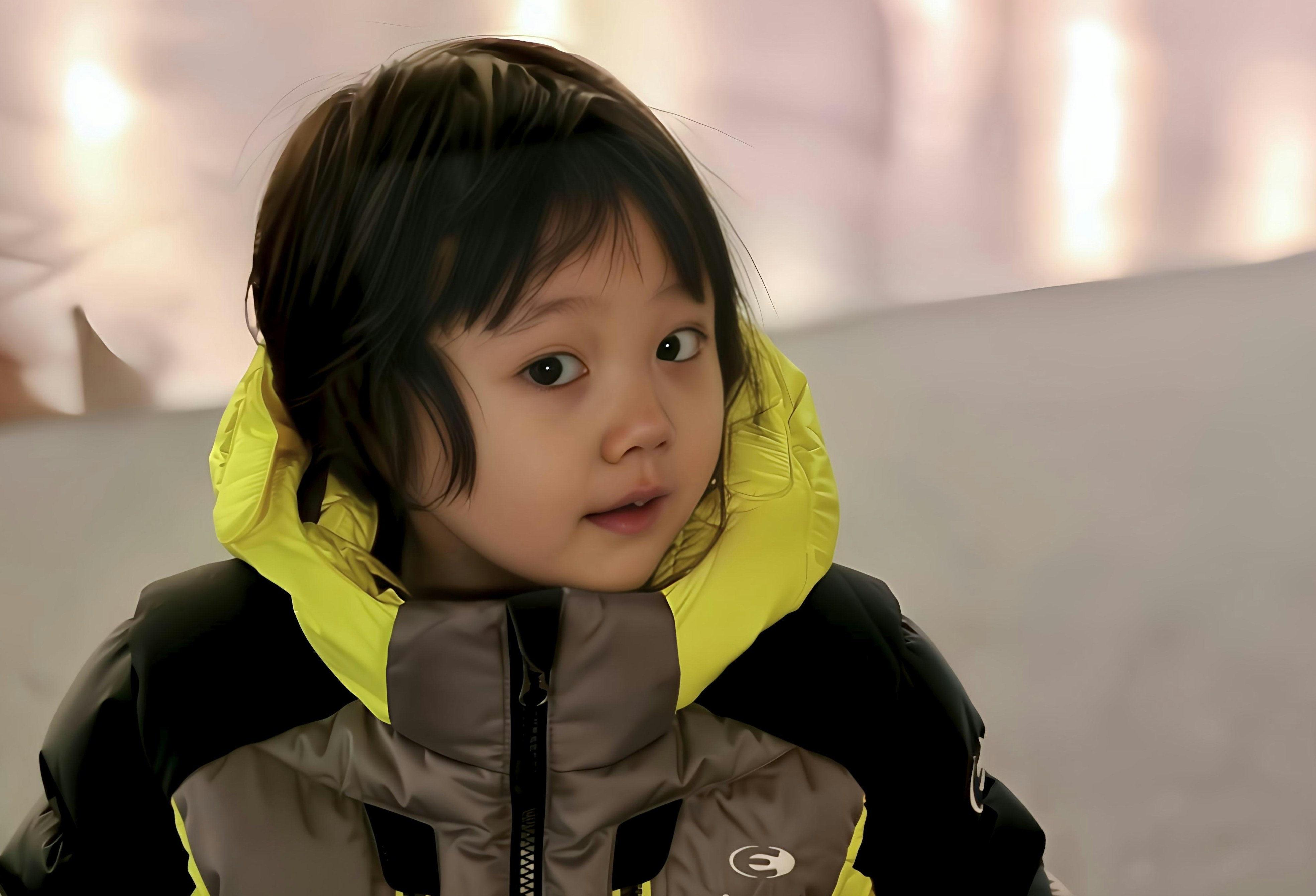 A Glimpse of Innocence in Vibrant Winter Gear