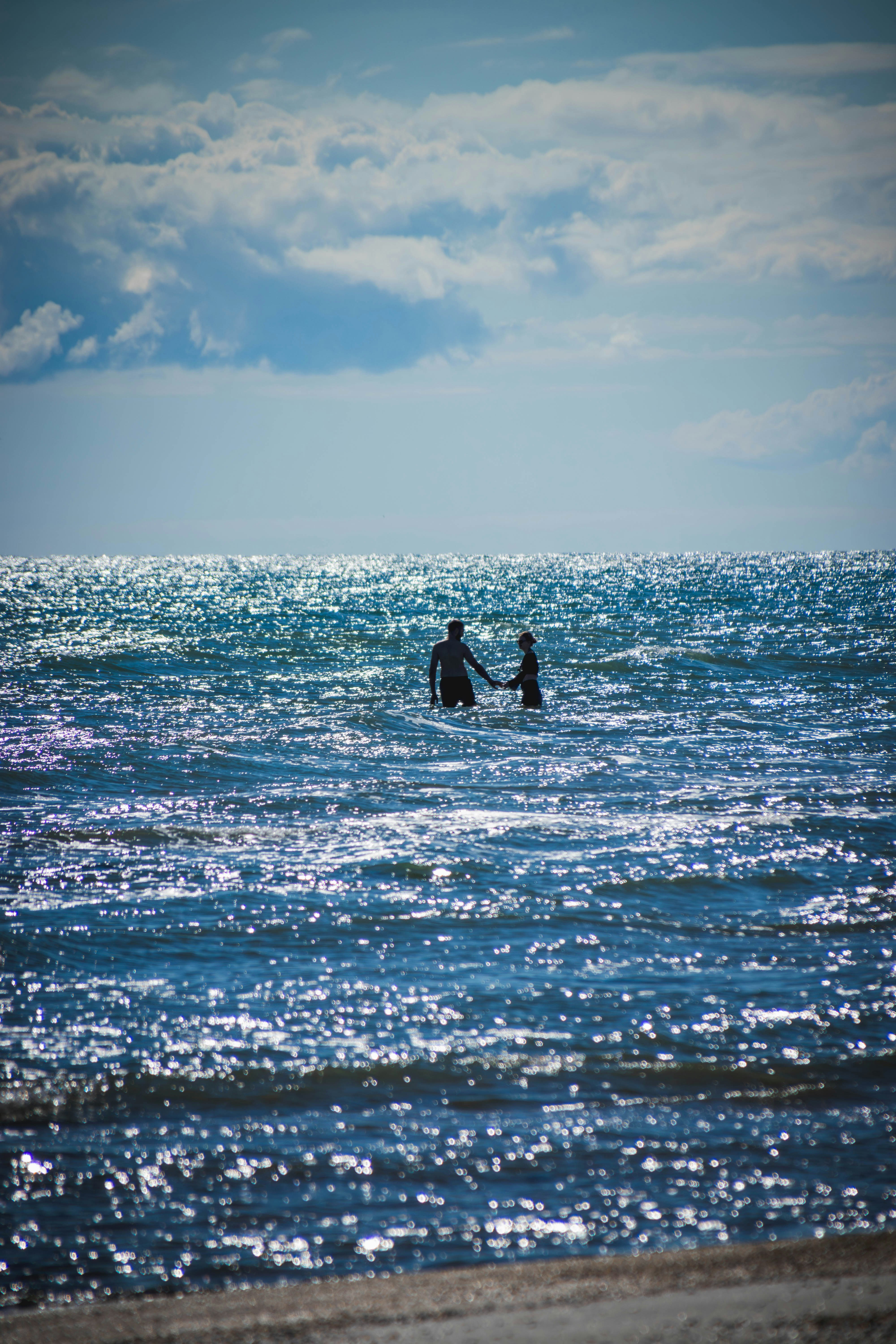 Tidal Embrace: A Moment in the Waves
