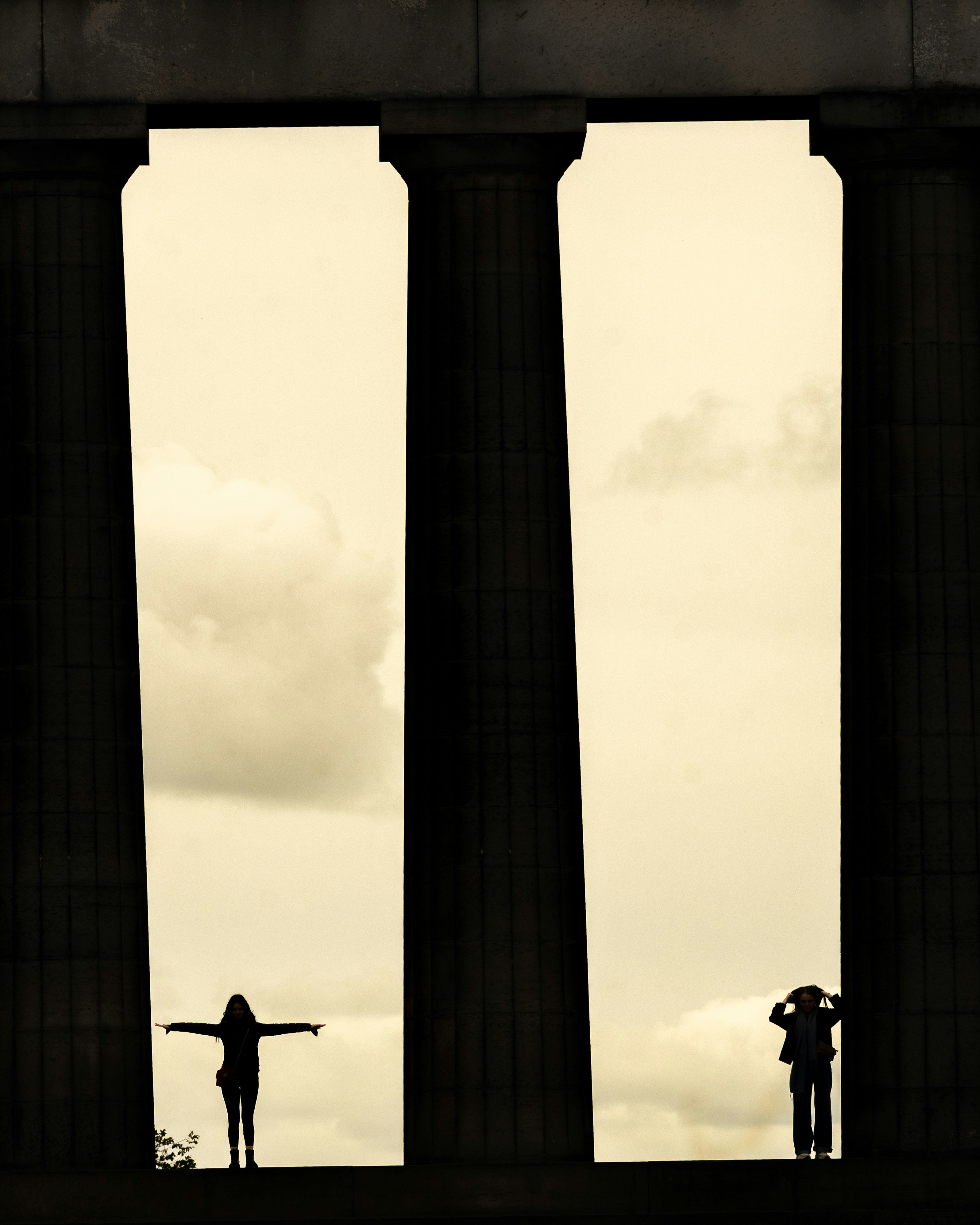Silhouettes in Architectural Embrace