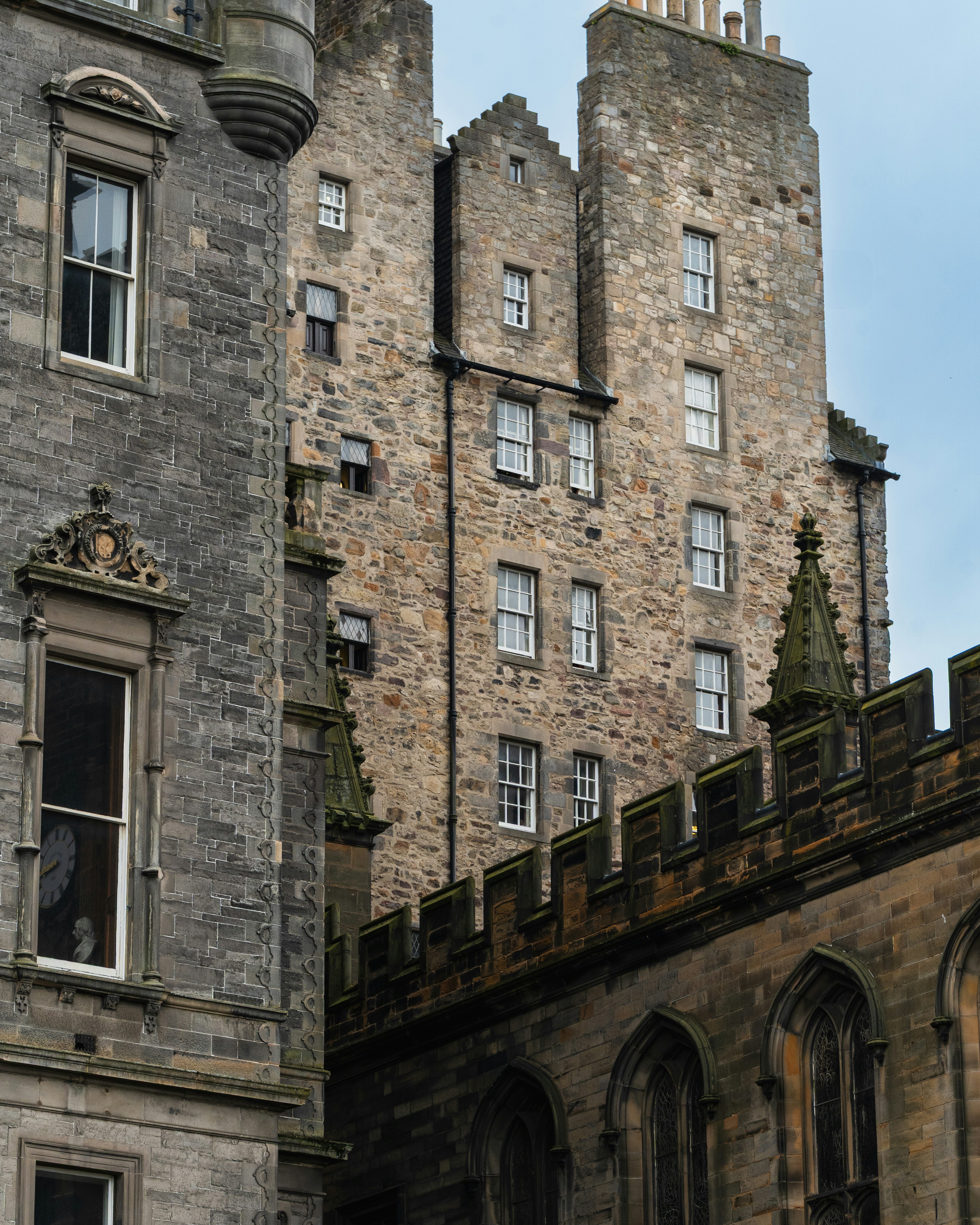 Old stone buildings with many windows under sky