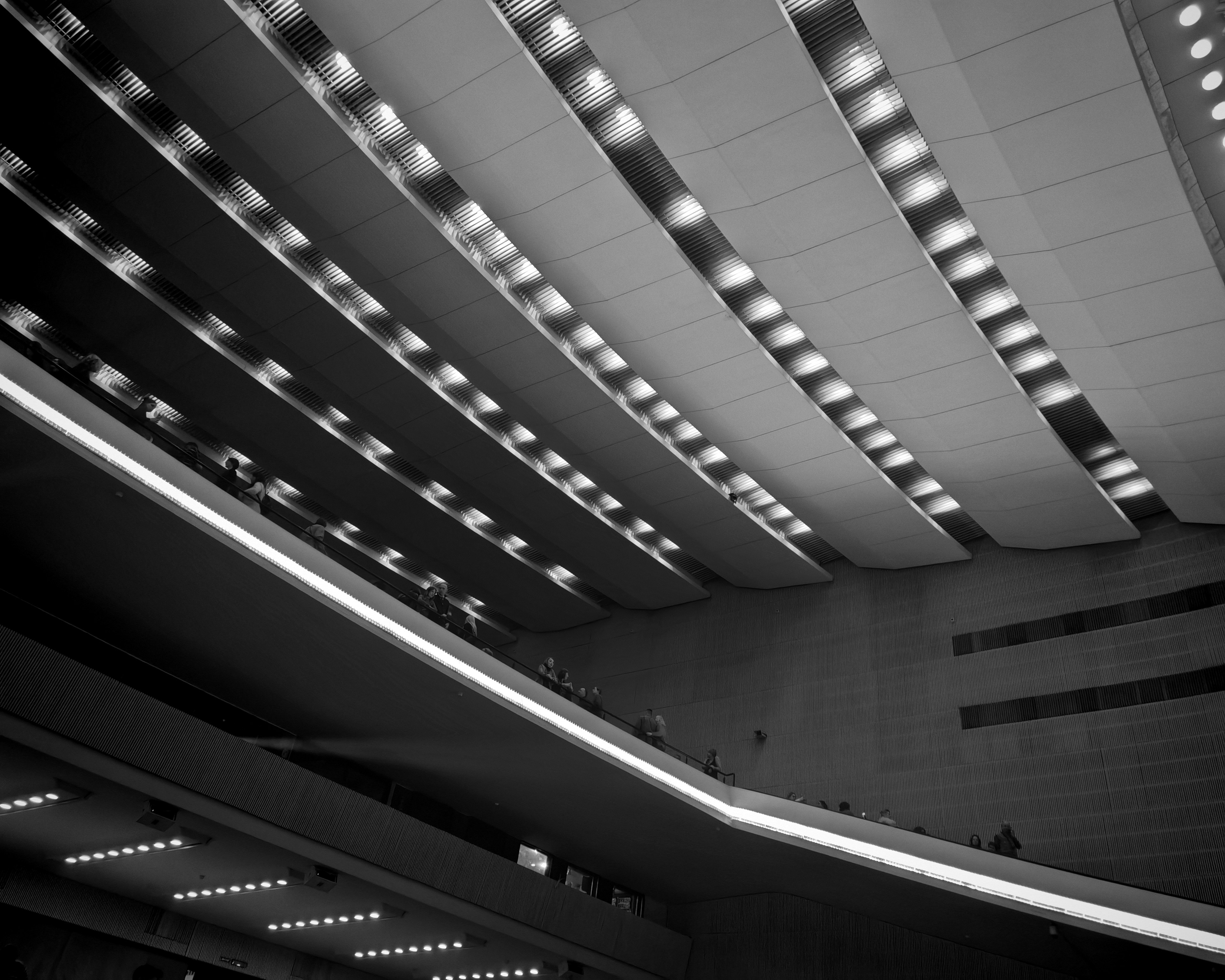 Modern building interior with illuminated ceiling panels