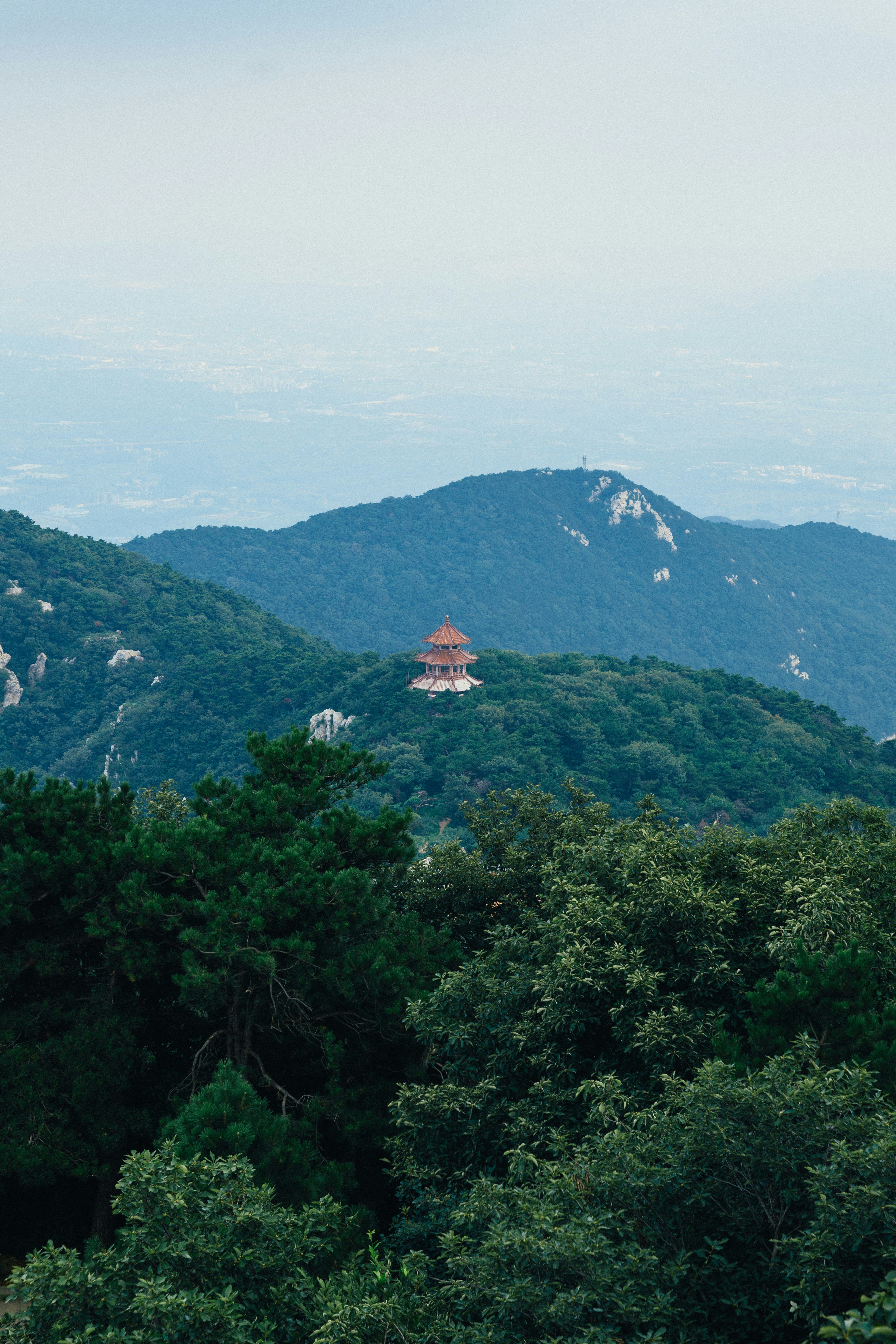 Serenity Among the Peaks: A Temple in the Mist