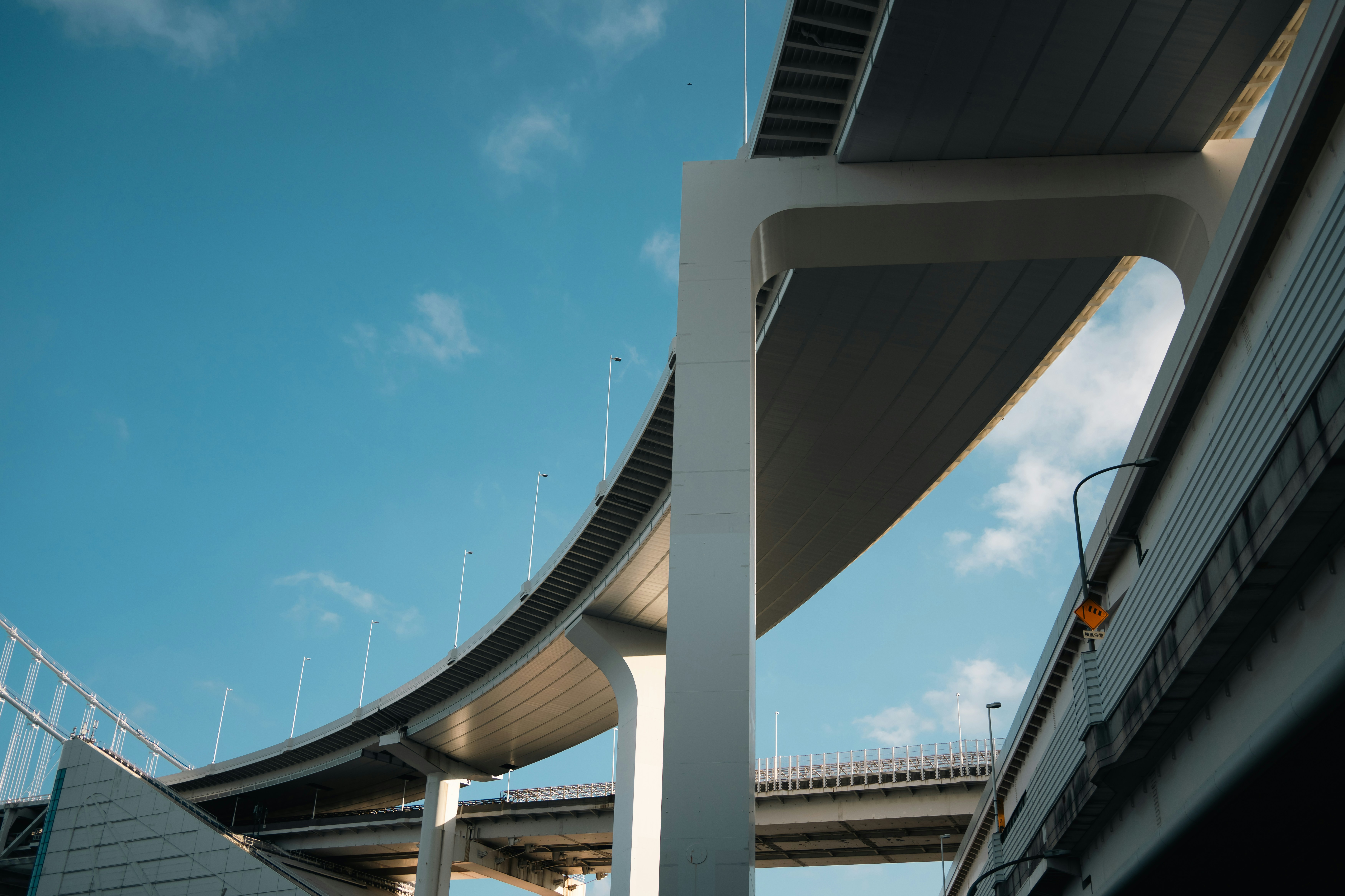 Curving elevated highways against a clear blue sky photo – Free Clouds ...