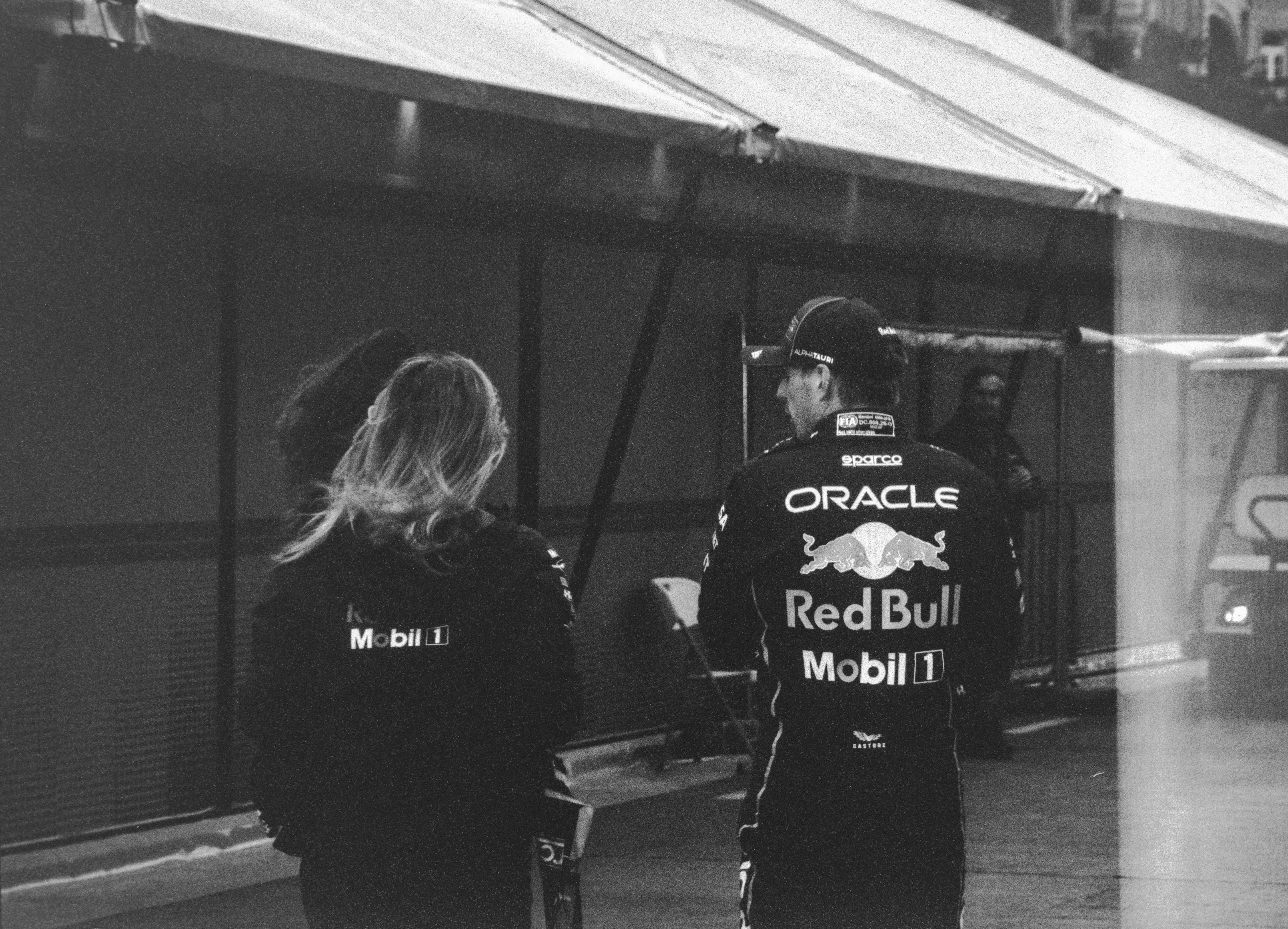 Two people in red bull racing jackets near tent photo – Free Focus ...