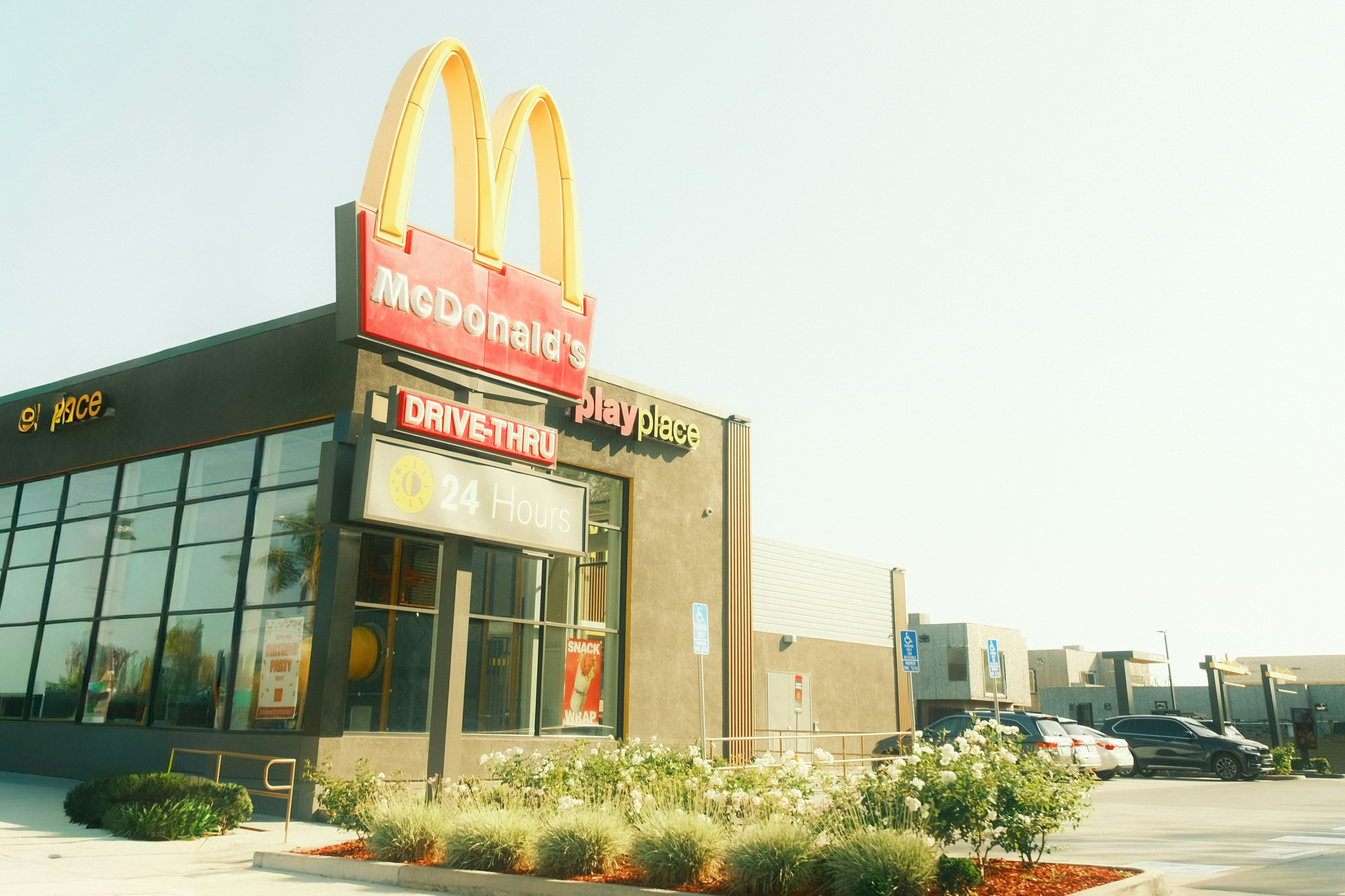 Mcdonald's restaurant with drive-thru lane.