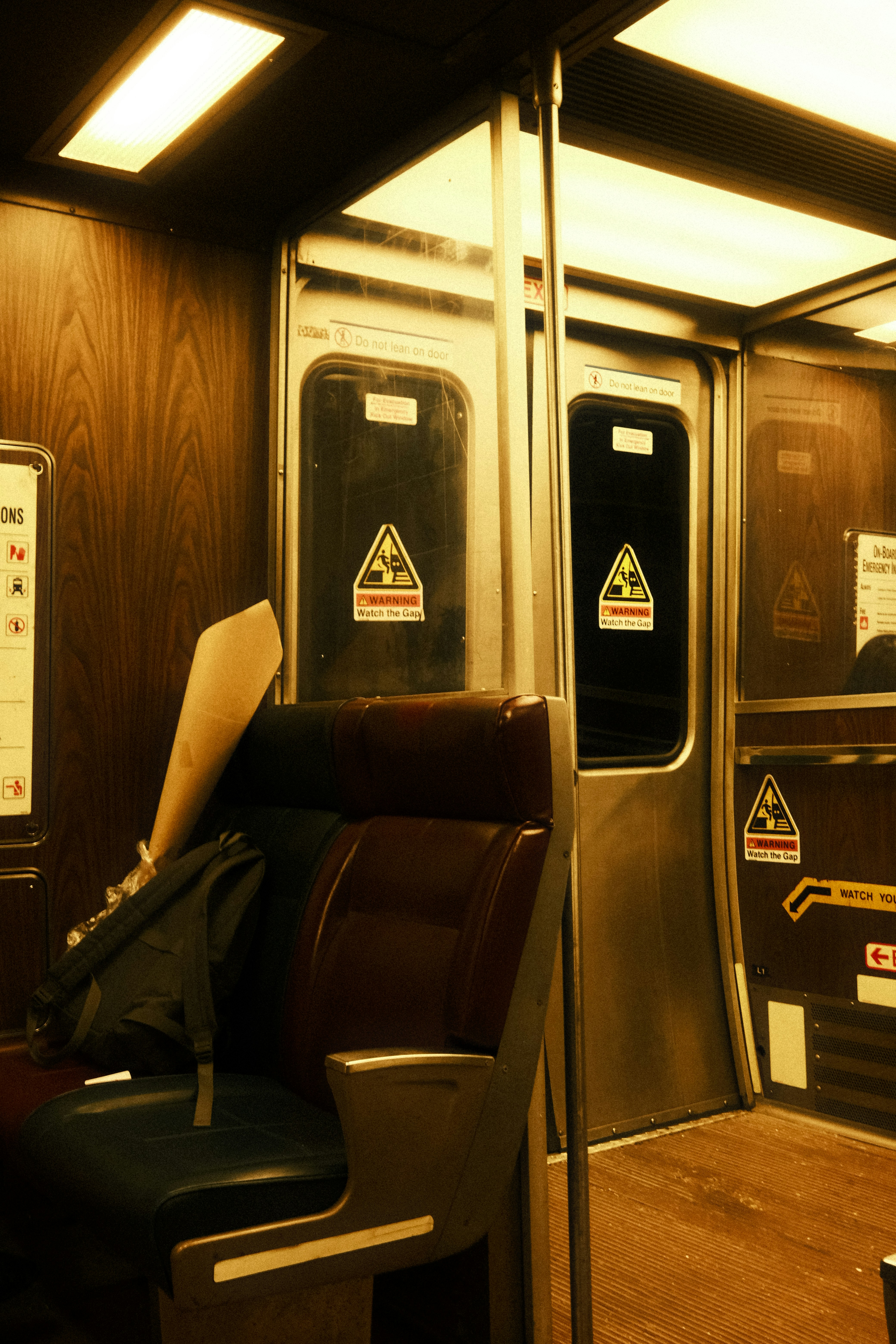 Vacant Seat, Luminous Doors: Quiet Edge of the Subway Car