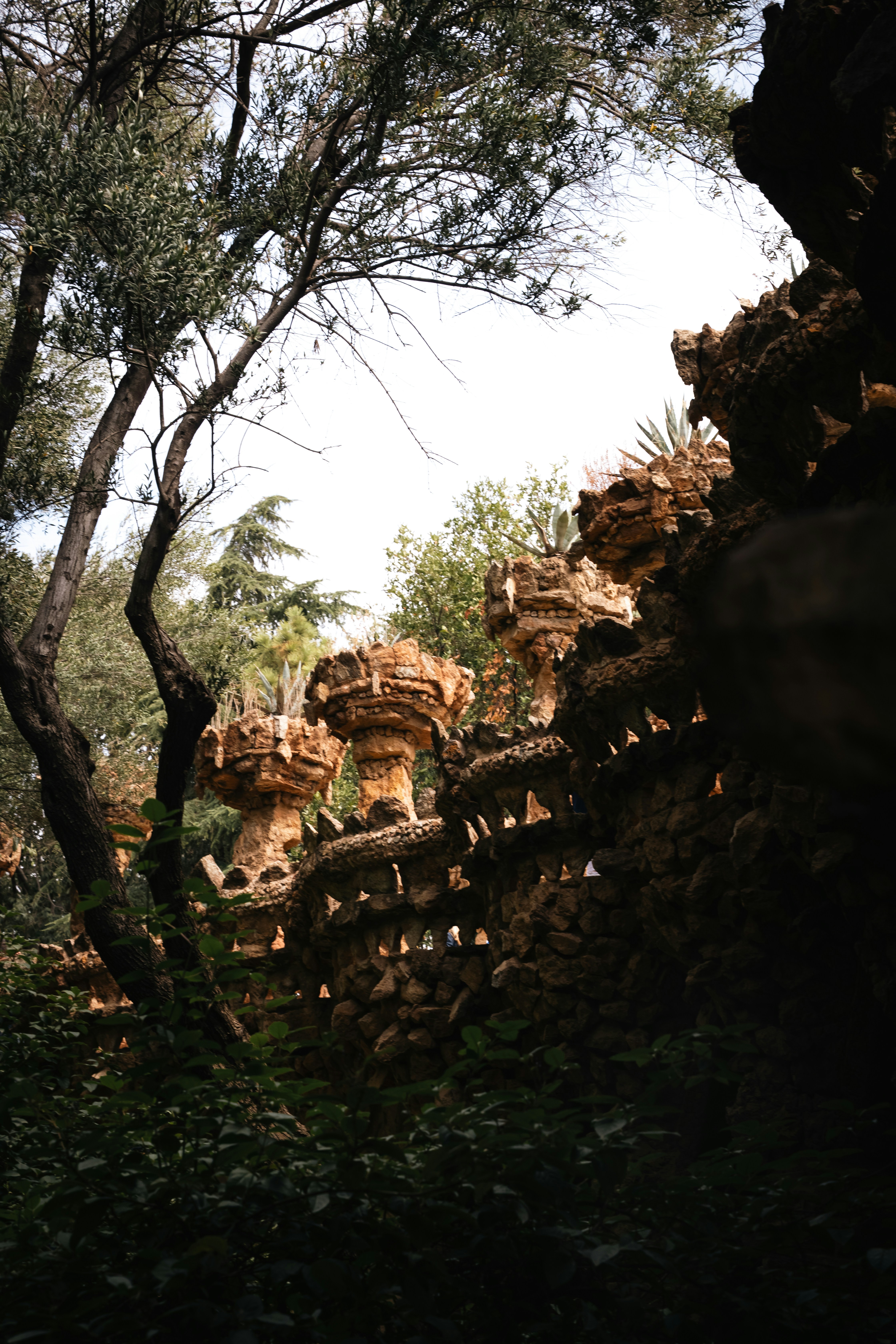 Stone structures with trees in a park