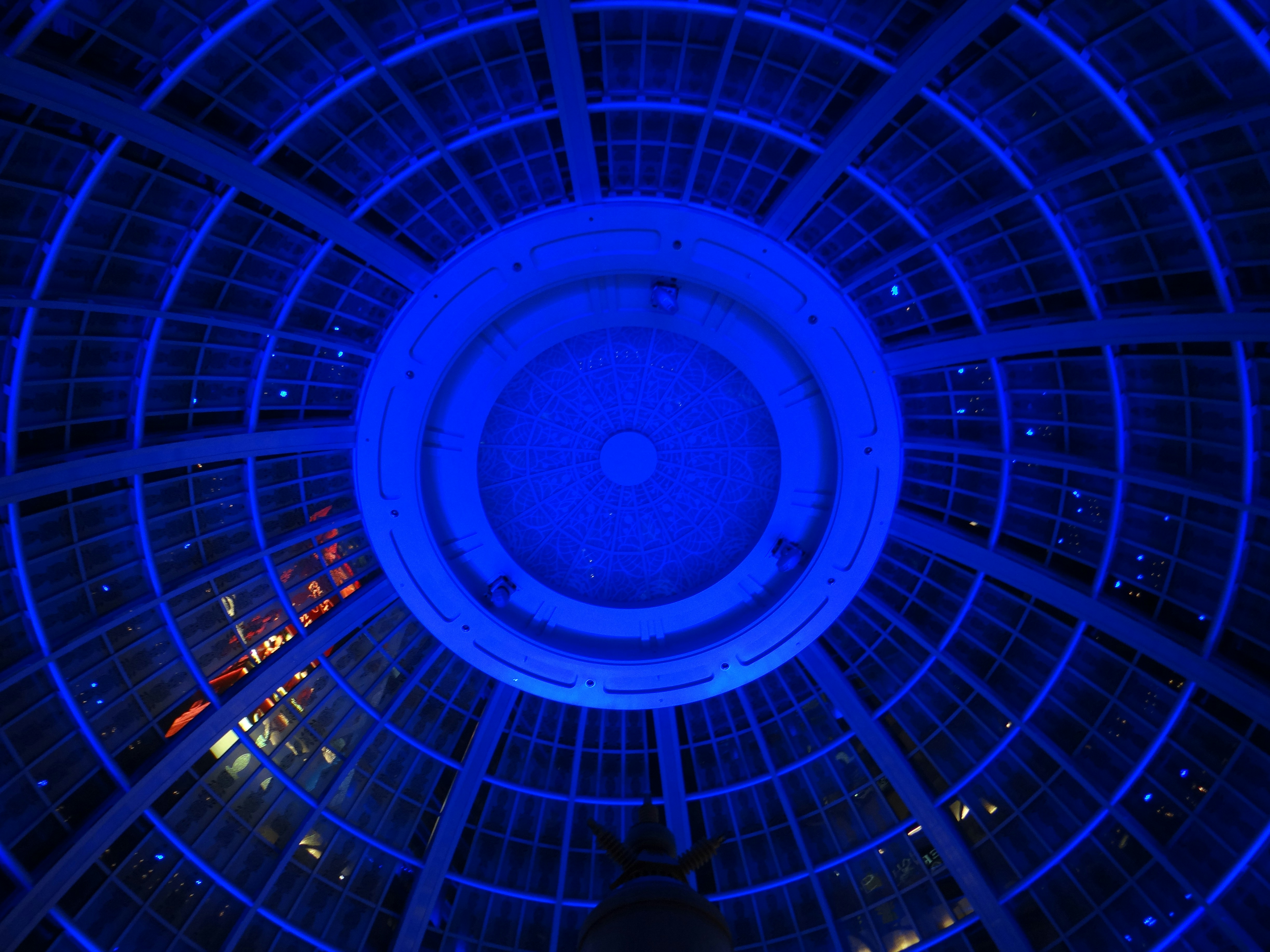 A bright blue dome ceiling with radiating lines.