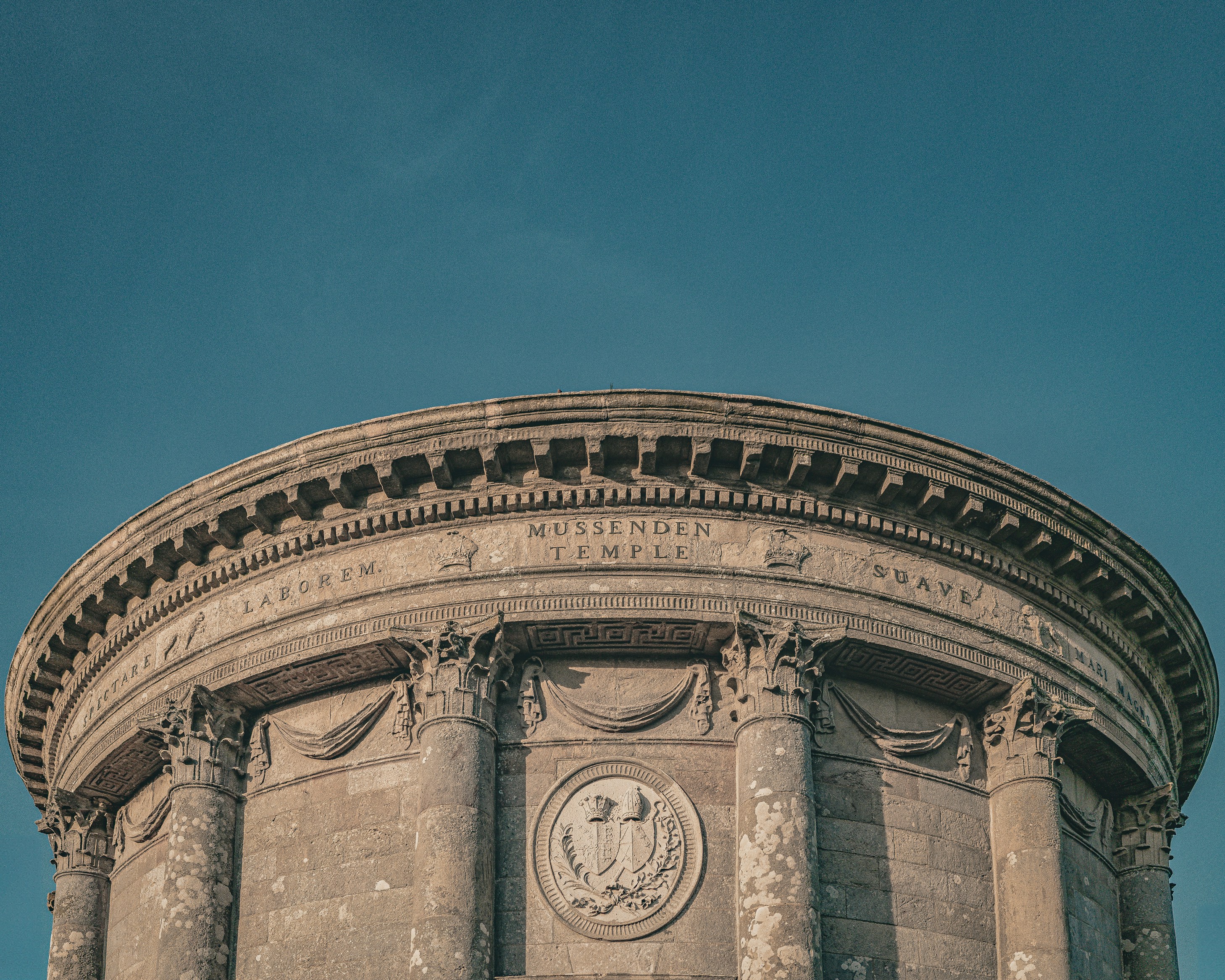 Circular stone monument with columns under a blue sky photo – Free Blue ...