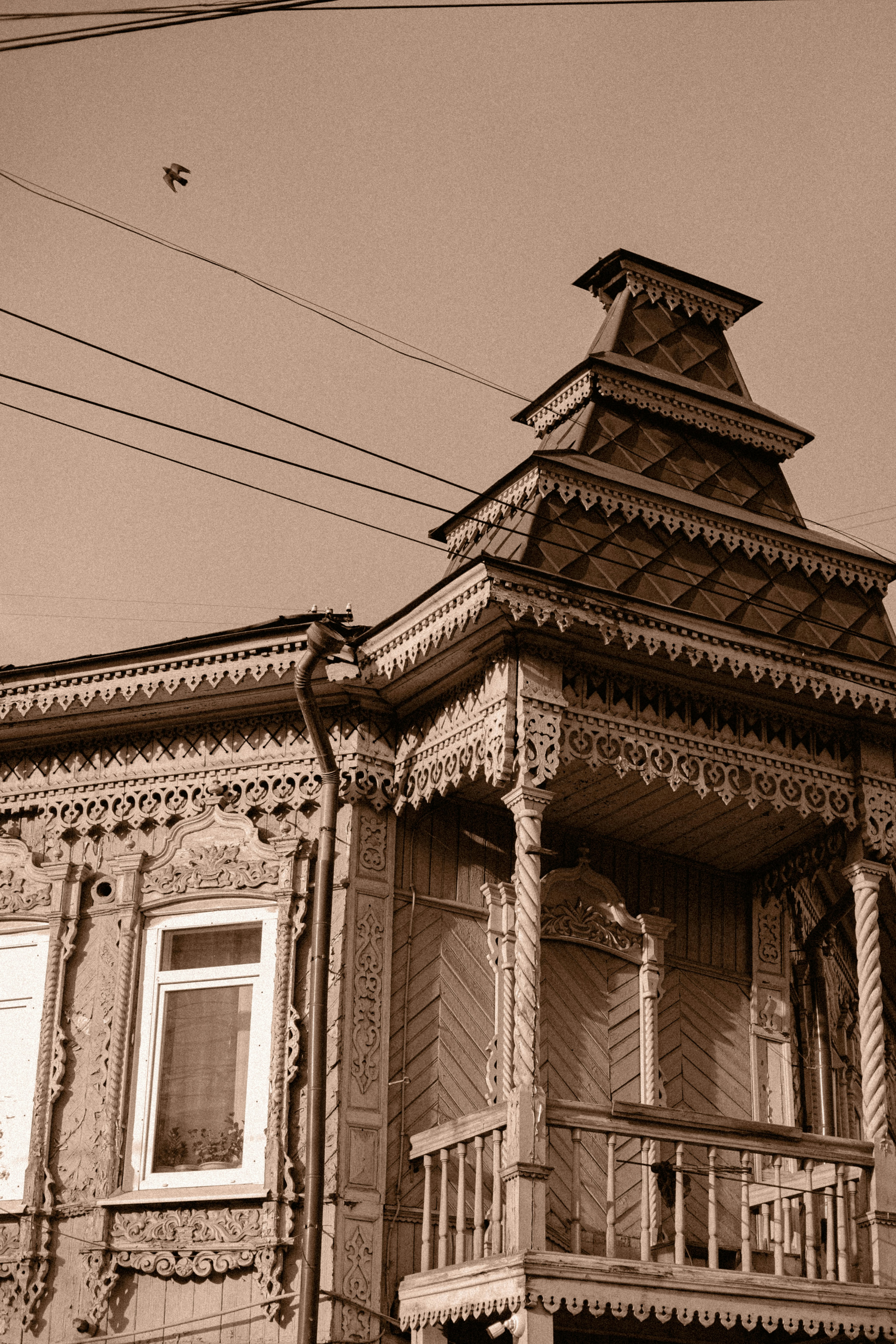 Sepia Lacework: Timber-Veranda Tower in Quiet Geometry