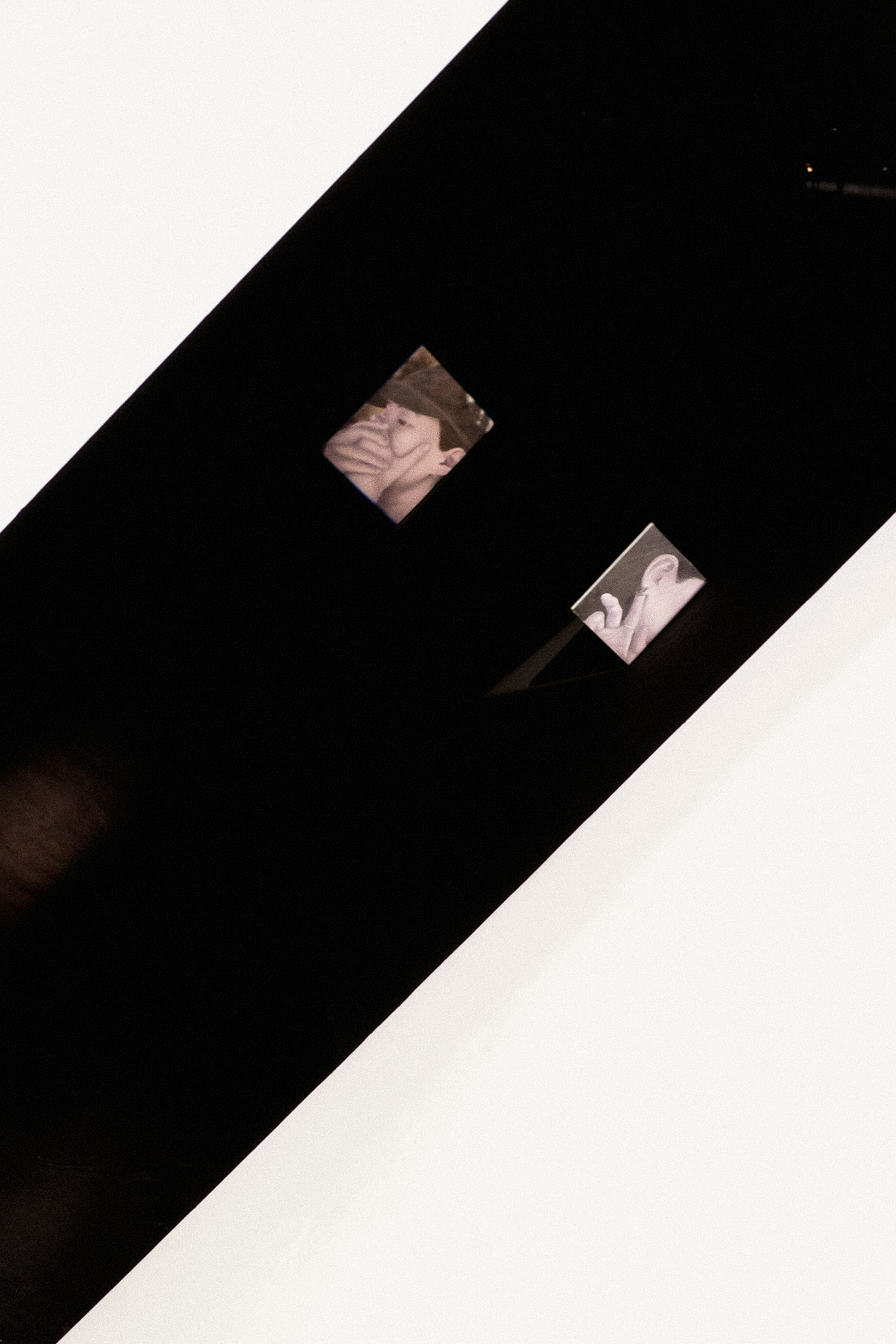 Heh, pick up a fallen leaf~ In the forgotten corner of life, watch the ups and downs of the world through the leaf. Heh, little joys. Someone said: Don't ask what the future will be like? We will wait together for the future of the future~ Heh, cameras and poems~ Xiao told me: The city is not very suitable for wandering and drifting~ Heh, tell me: A year's time won't pass too quickly~ When I can't see myself. | Two small portraits on a black reflective surface.