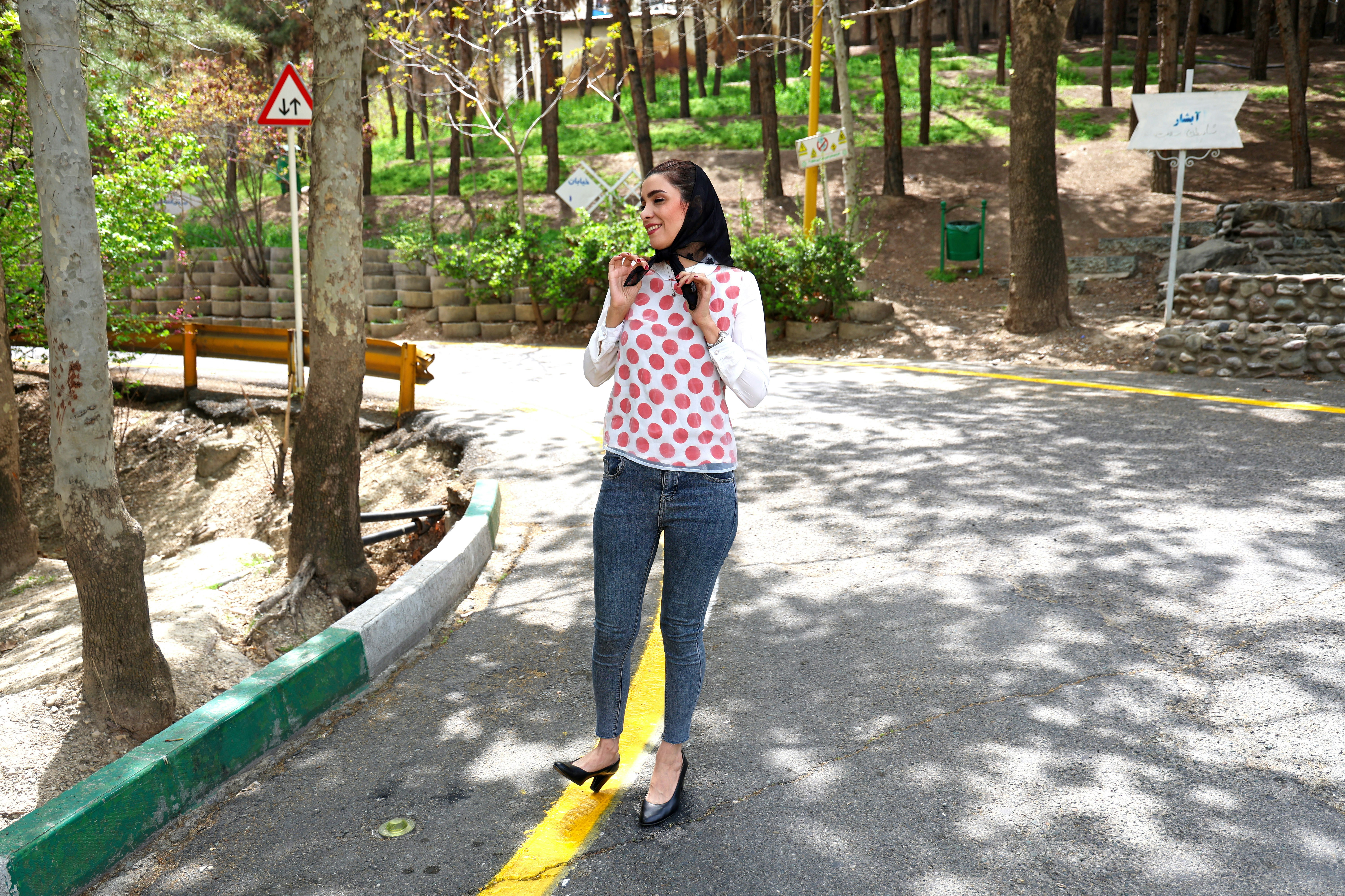 Polka-Dot Poise on a Sunlit Park Road