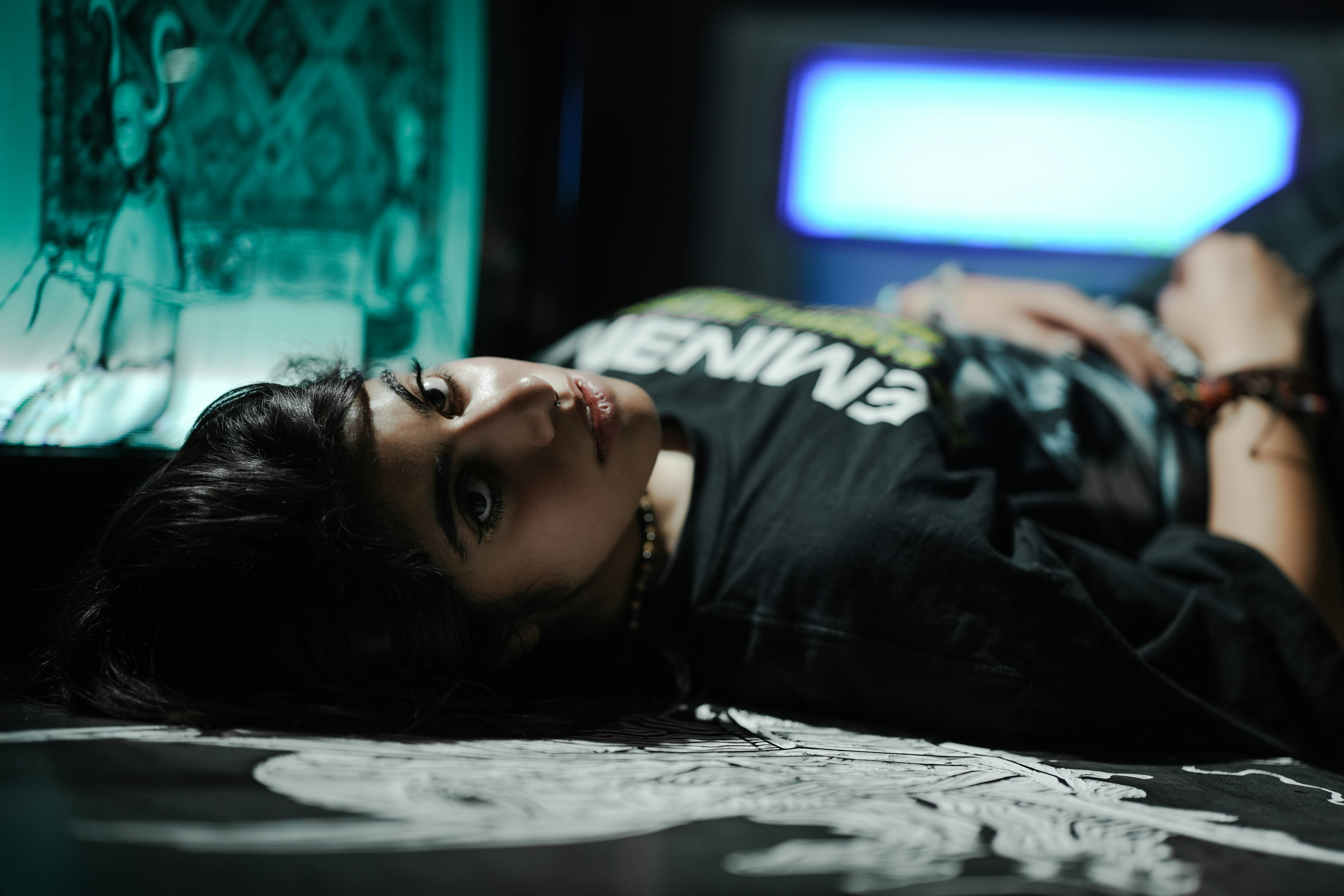 Neon Gaze: A Lying Portrait in a Dim Studio