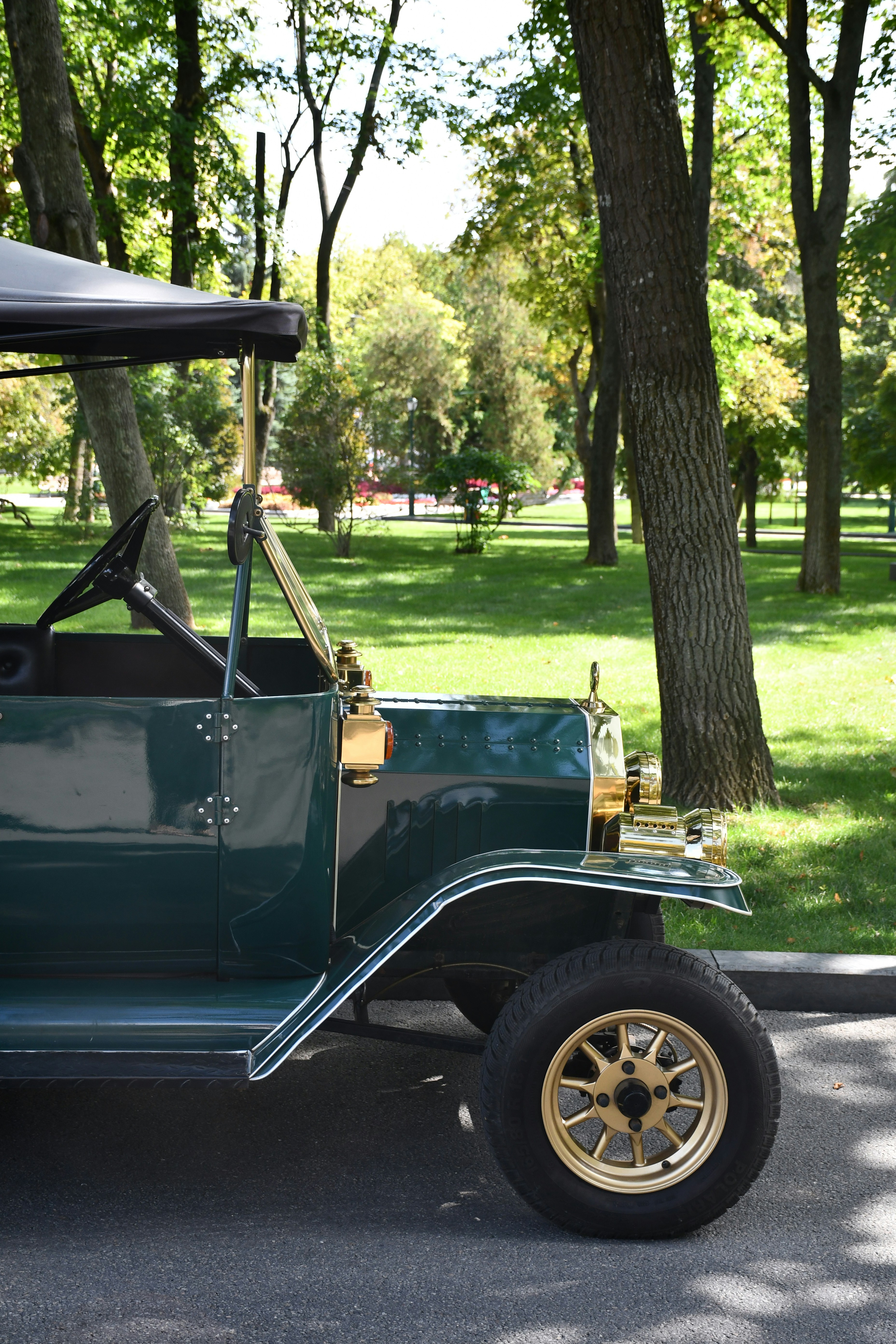 Vintage green car parked in a park