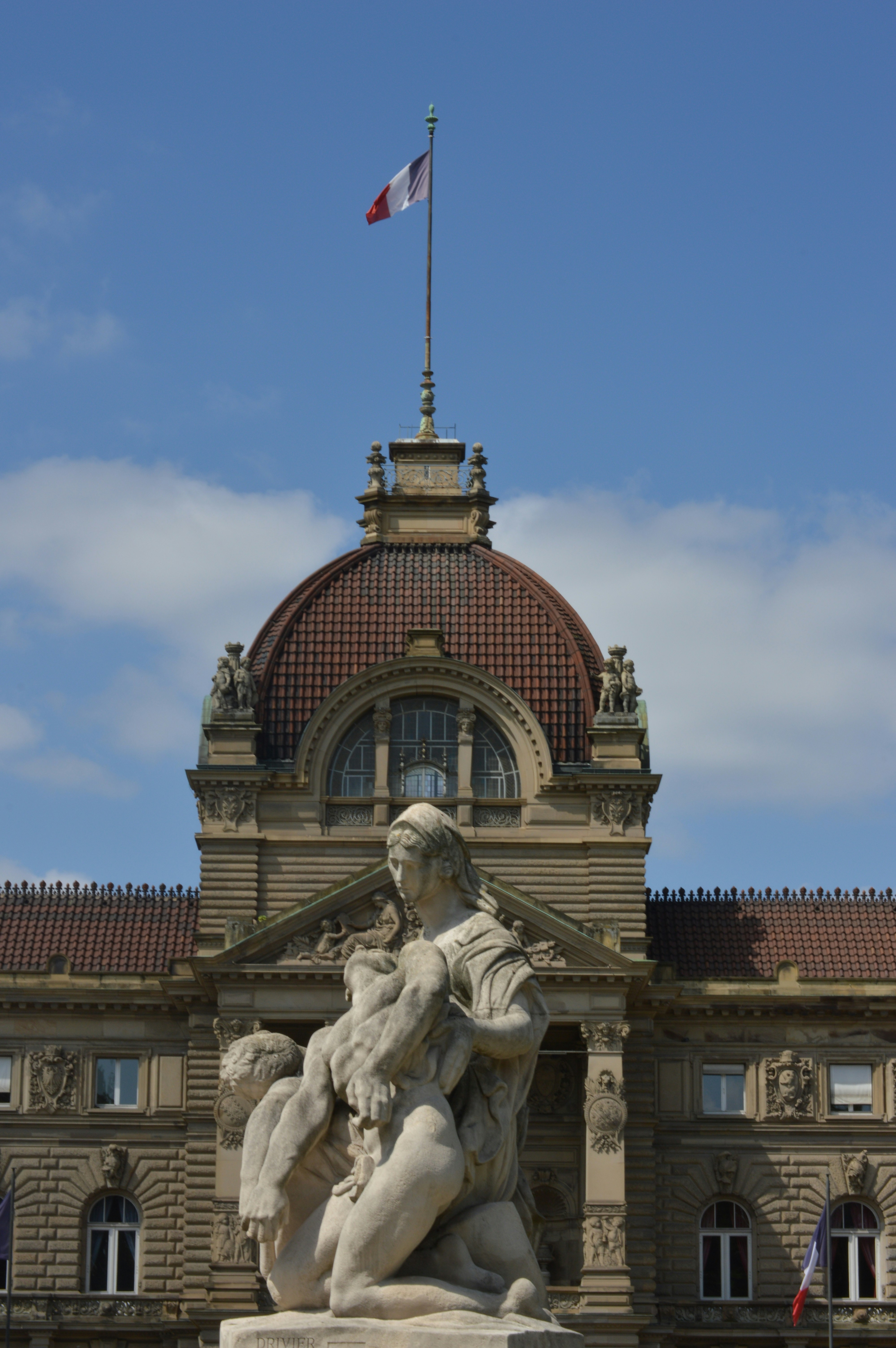 Marble Vigil Beneath a French-Domed Facade