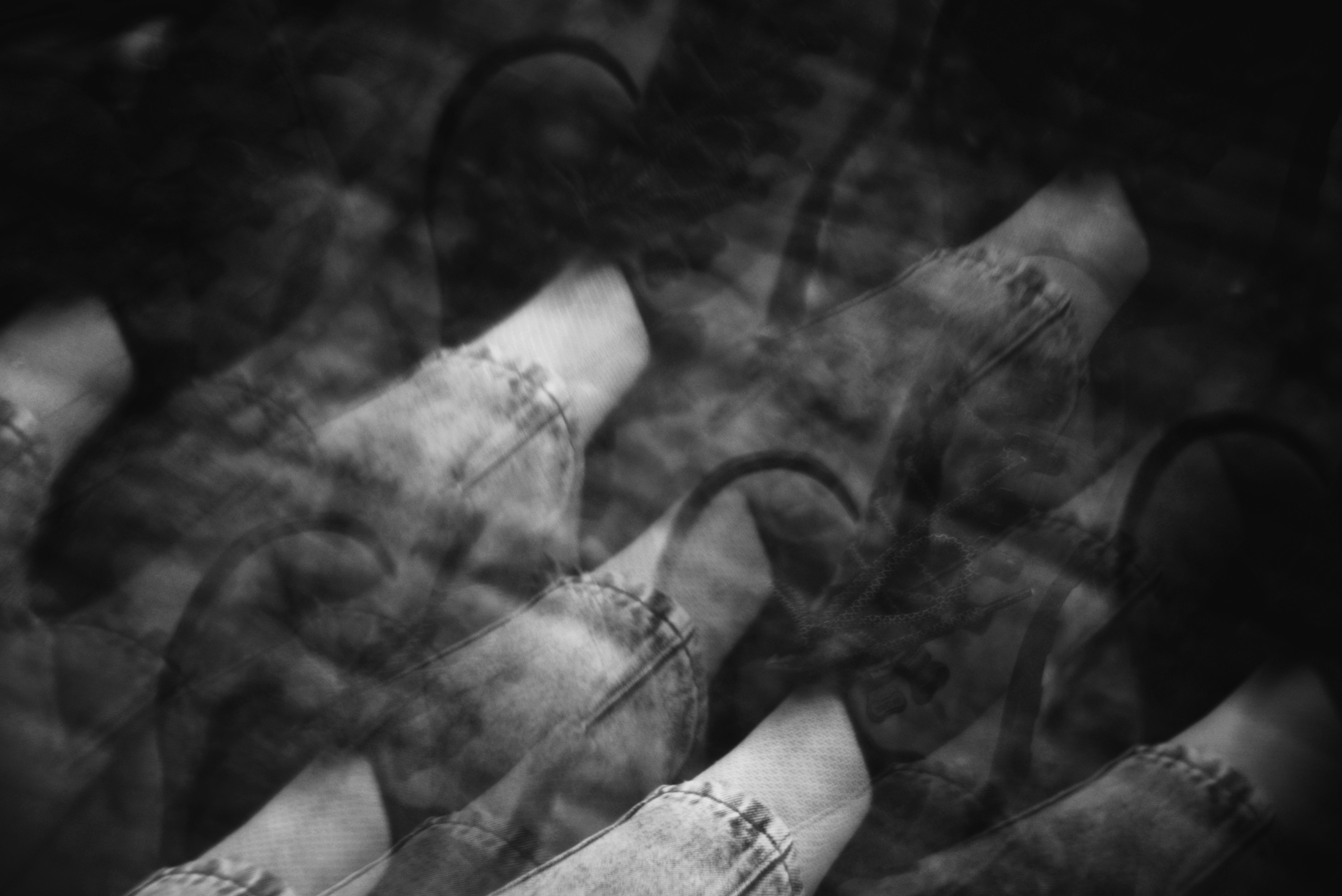 Abstract blurred pattern of wine bottles in grayscale