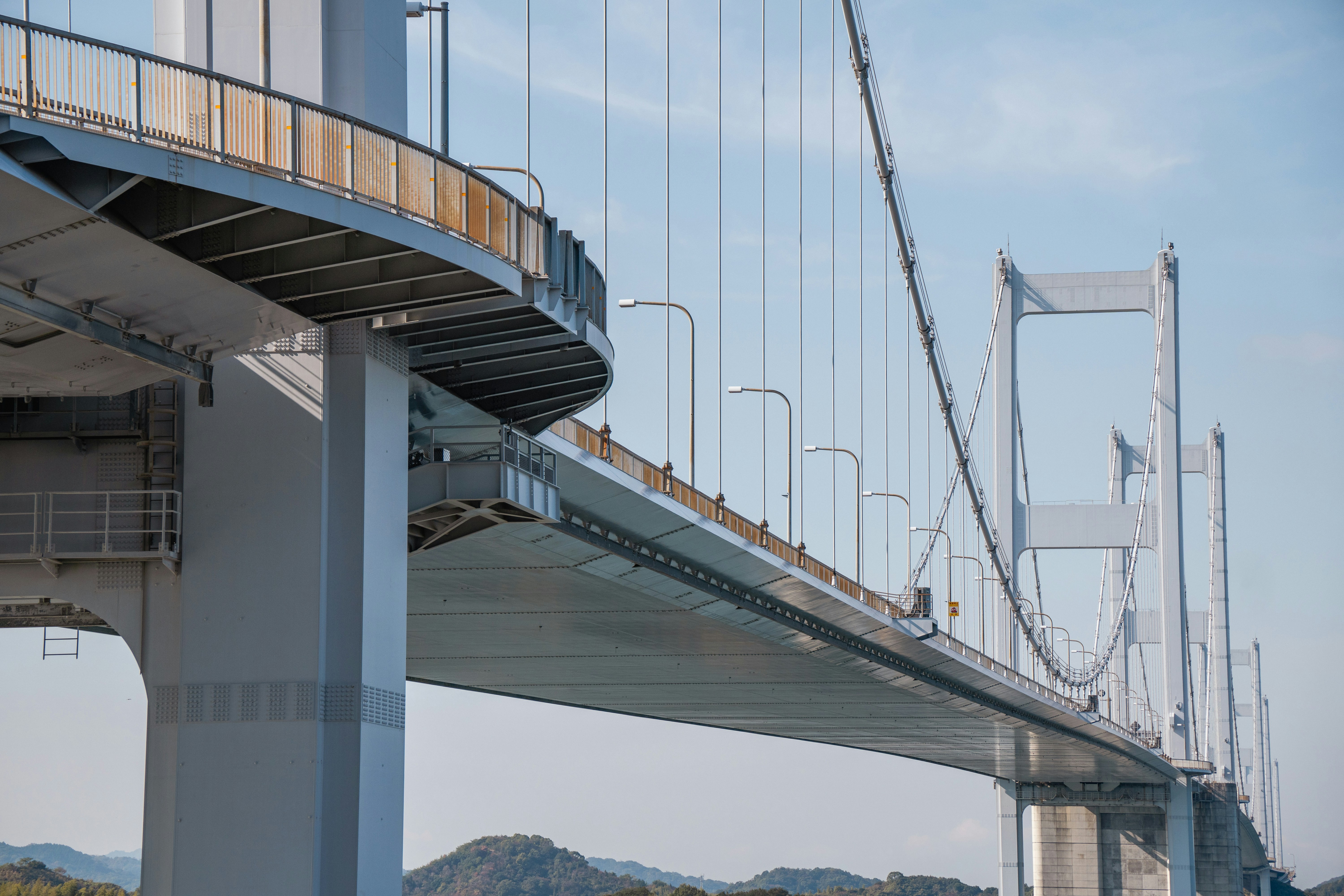 A modern suspension bridge against a clear sky photo – Free ...